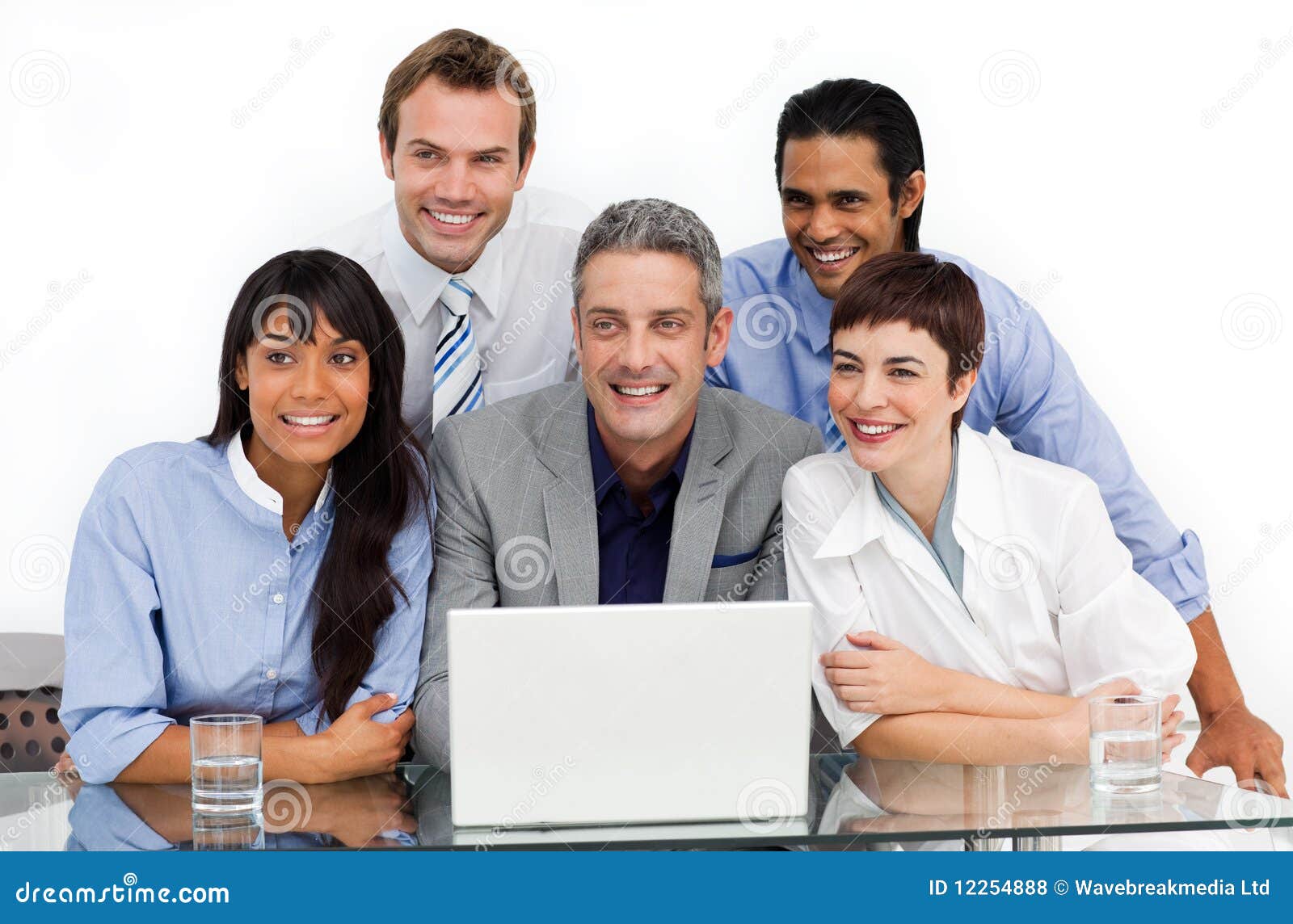 Smiling Business Group Using a Laptop Stock Photo - Image of meeting ...