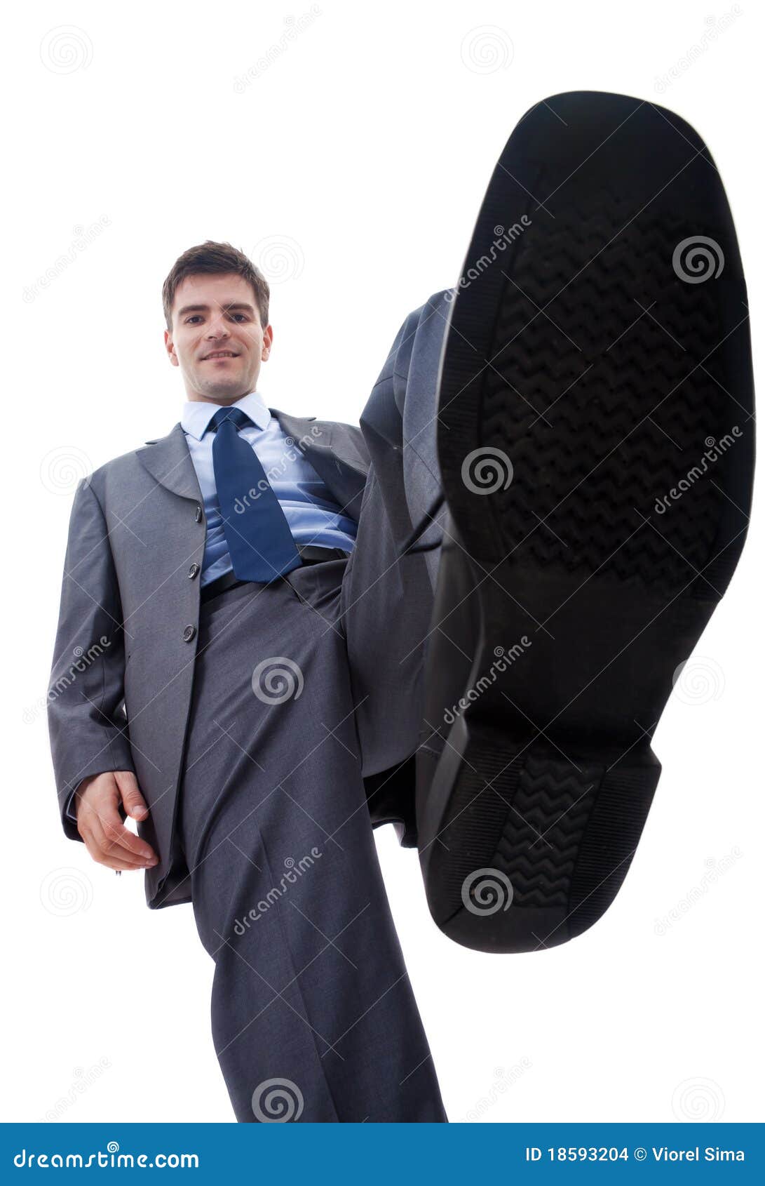 Smiling Business Man Steping on Something Stock Photo - Image of shoe ...