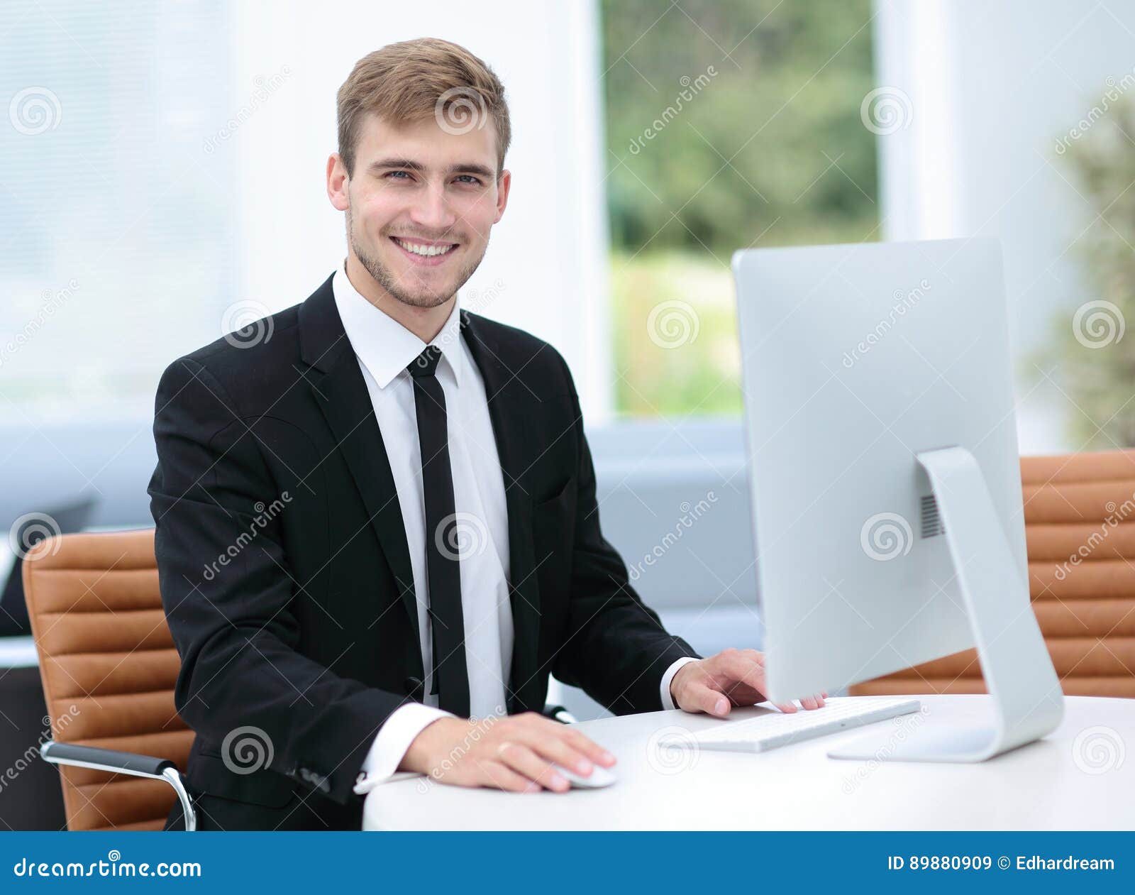 Smiling Business Man Working on Computer in a Modern Office Stock Image ...
