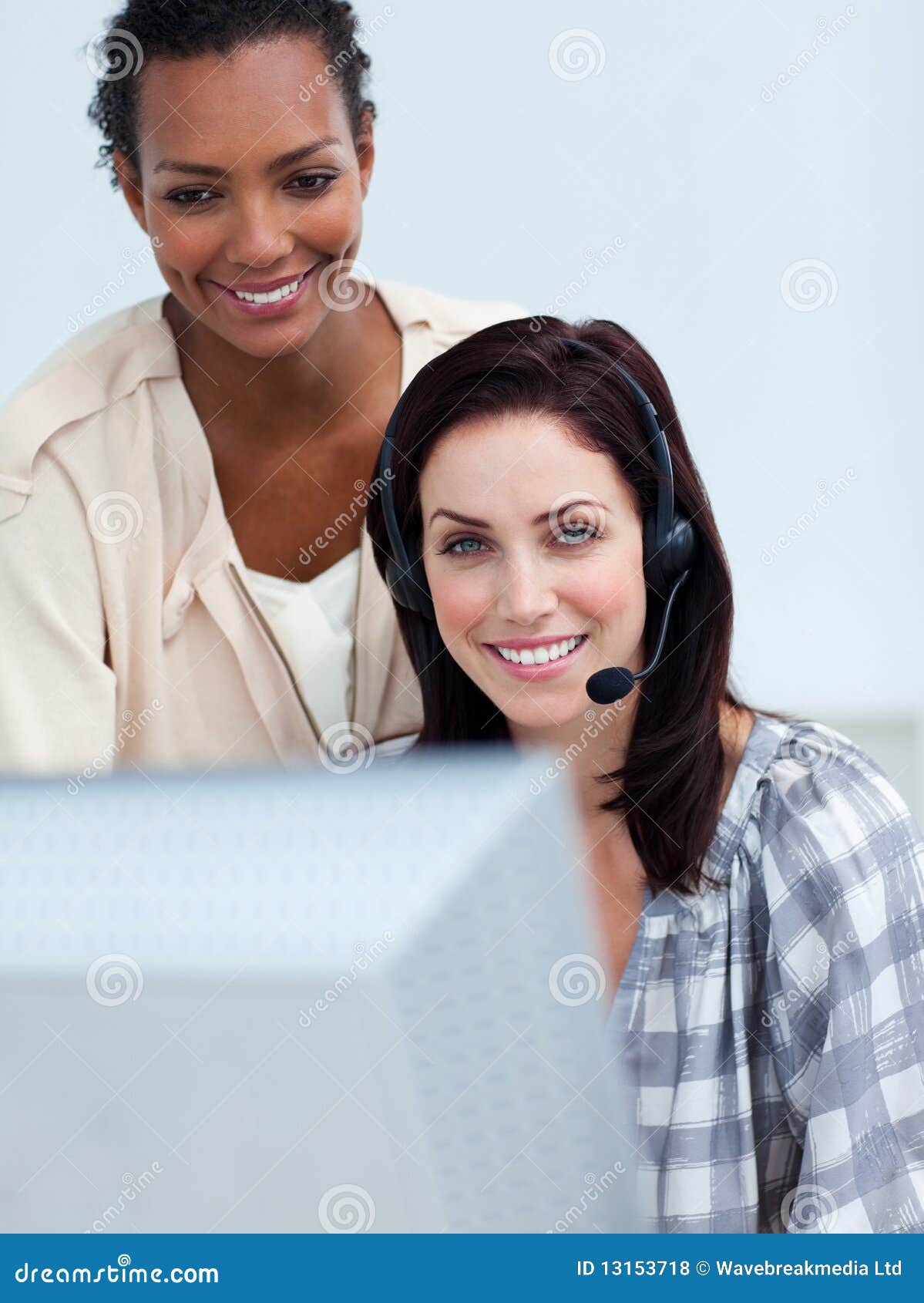 Smiling Business Partners Working at a Computer Stock Photo - Image of ...