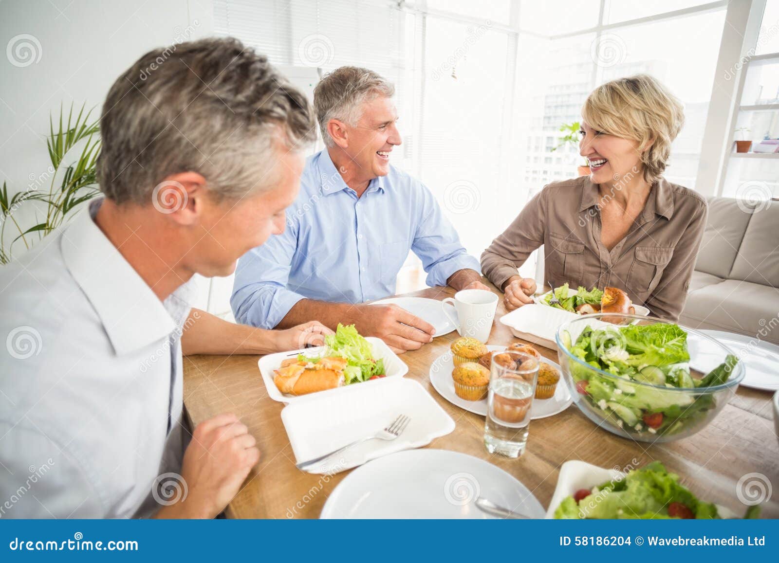 Smiling Business People Having Lunch Together Stock Photo - Image of ...