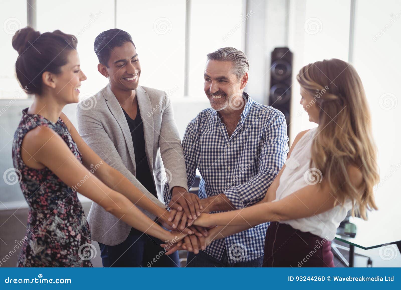 Smiling Business People Stacking Hands Stock Photo - Image of mature ...
