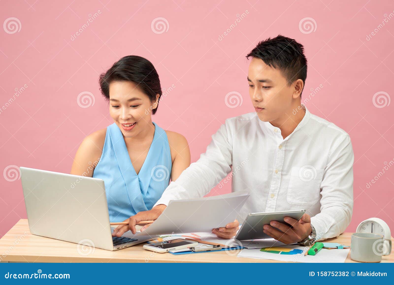 Smiling Business People Using a Computer in Their Office Stock Photo ...