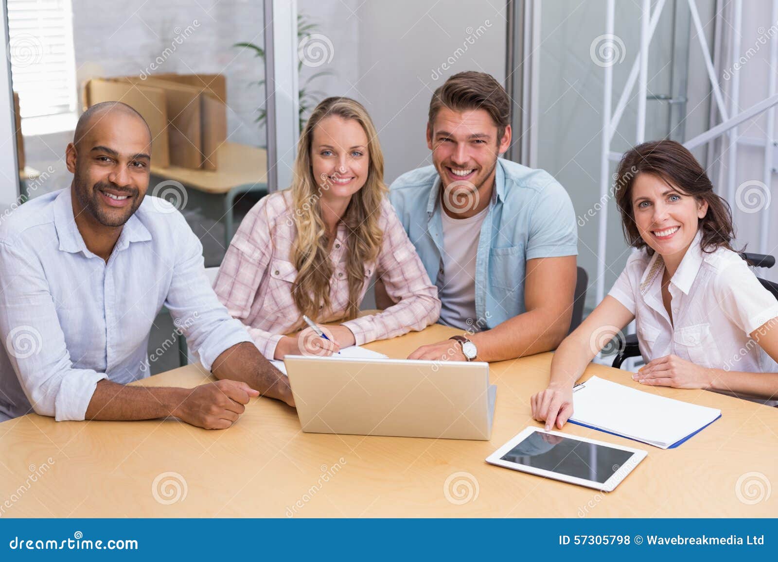 Smiling Business People Using Tablet Computer and Laptop Stock Photo ...