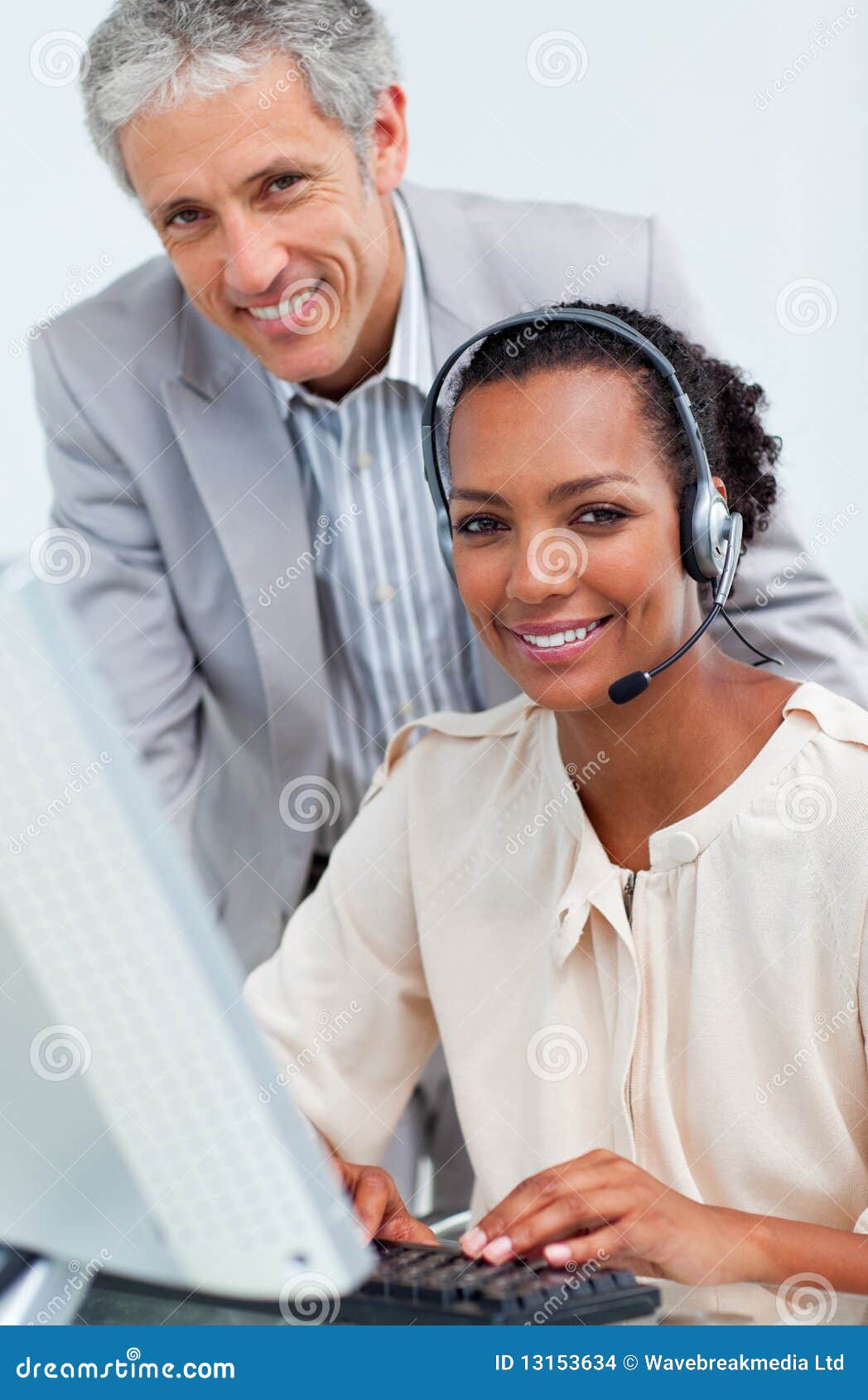 Smiling Business People Working at a Computer Stock Photo - Image of ...