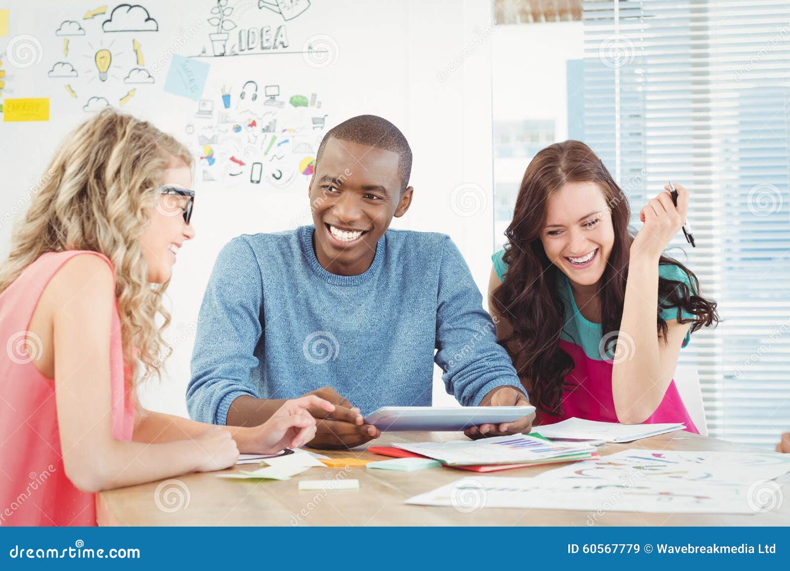 Smiling Business Professionals Using Digital Tablet at Desk Stock Image ...