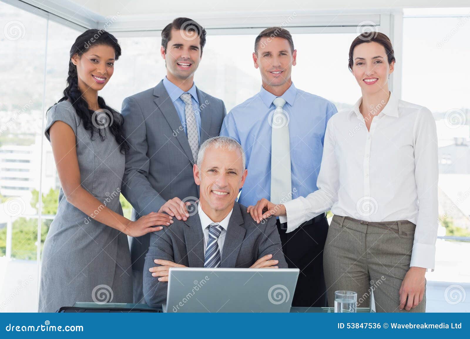 Smiling Business Team Looking at Camera Stock Photo - Image of female ...
