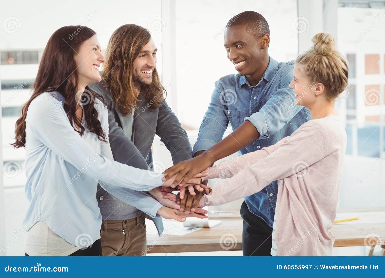 Smiling Business Team Putting Their Hands Together Stock Image - Image ...