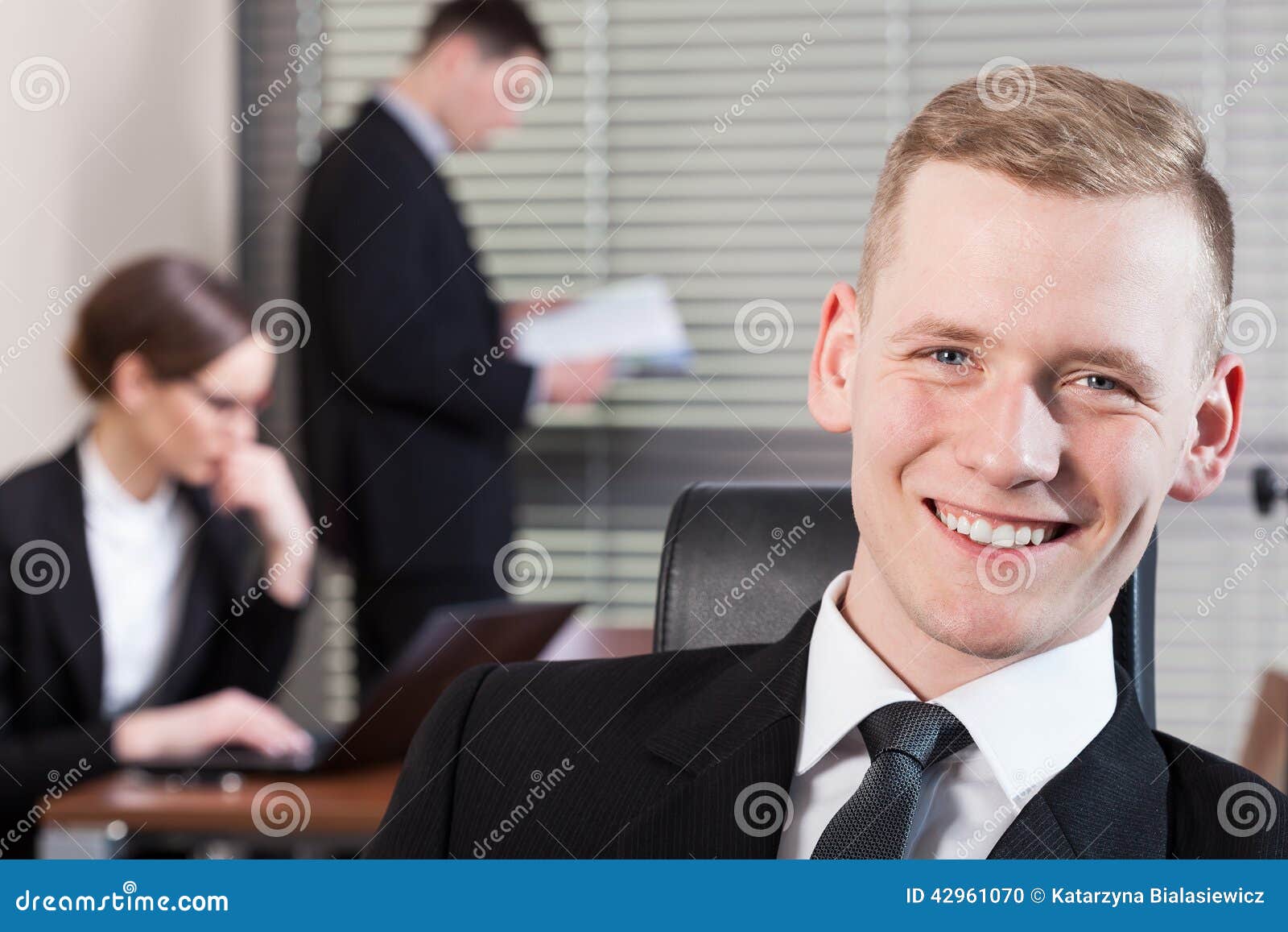 Smiling Businessman and His Co-workers Stock Photo - Image of ...