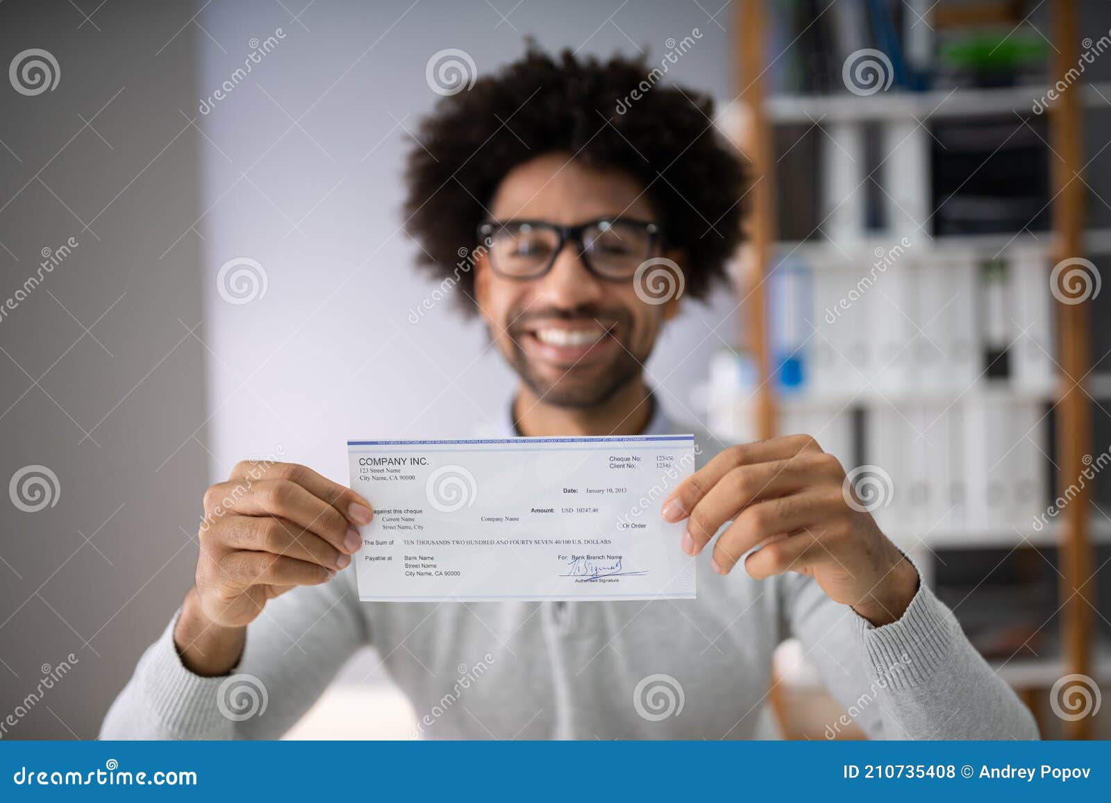 Smiling Businessman Holding Cheque Stock Photo - Image of checkbook ...