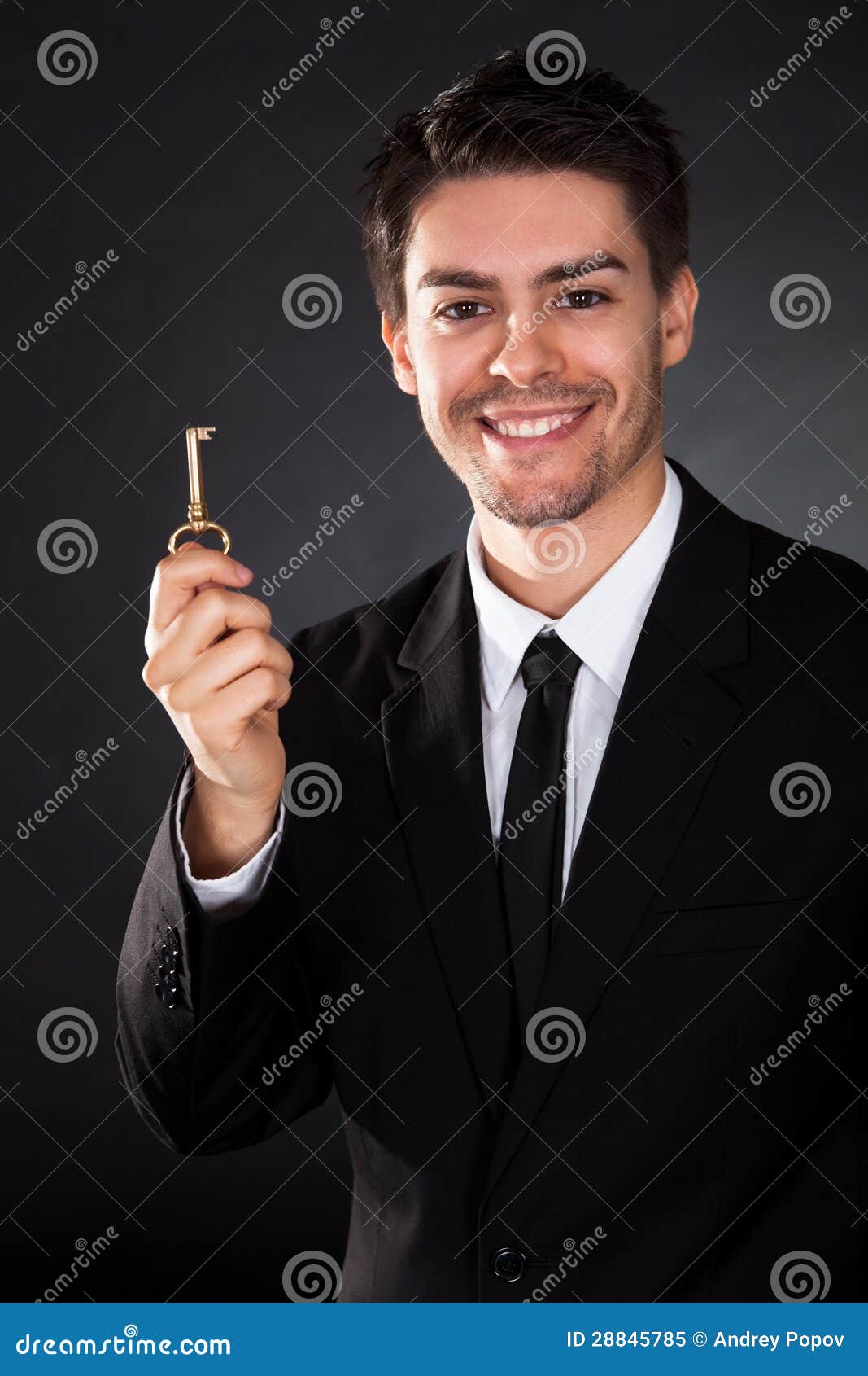 Smiling Businessman Holding a Golden Key Stock Image - Image of people ...