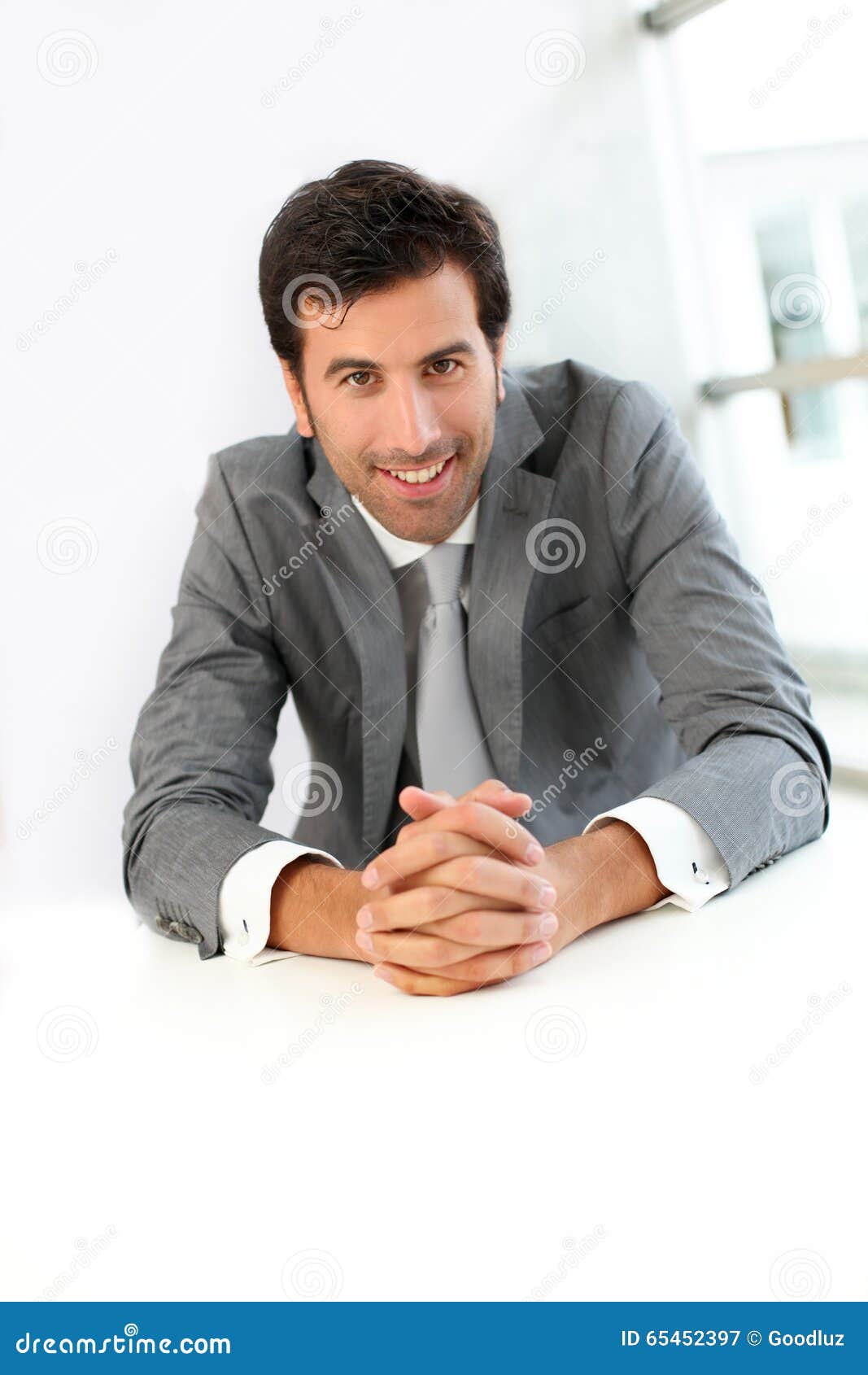 Smiling Businessman Listening To Client Stock Image - Image of smiling ...