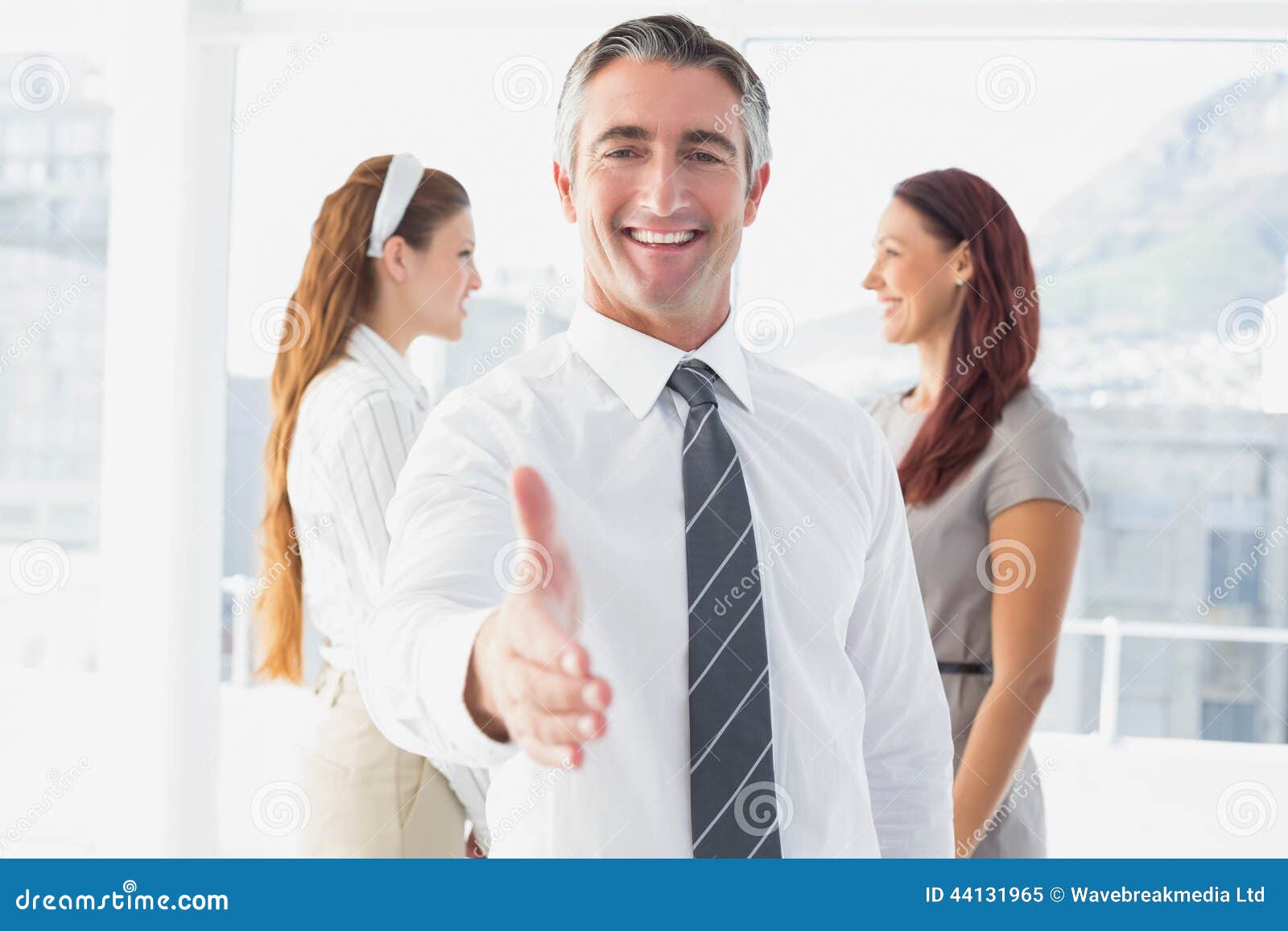 Smiling Businessman Offering a Handshake Stock Image - Image of female ...
