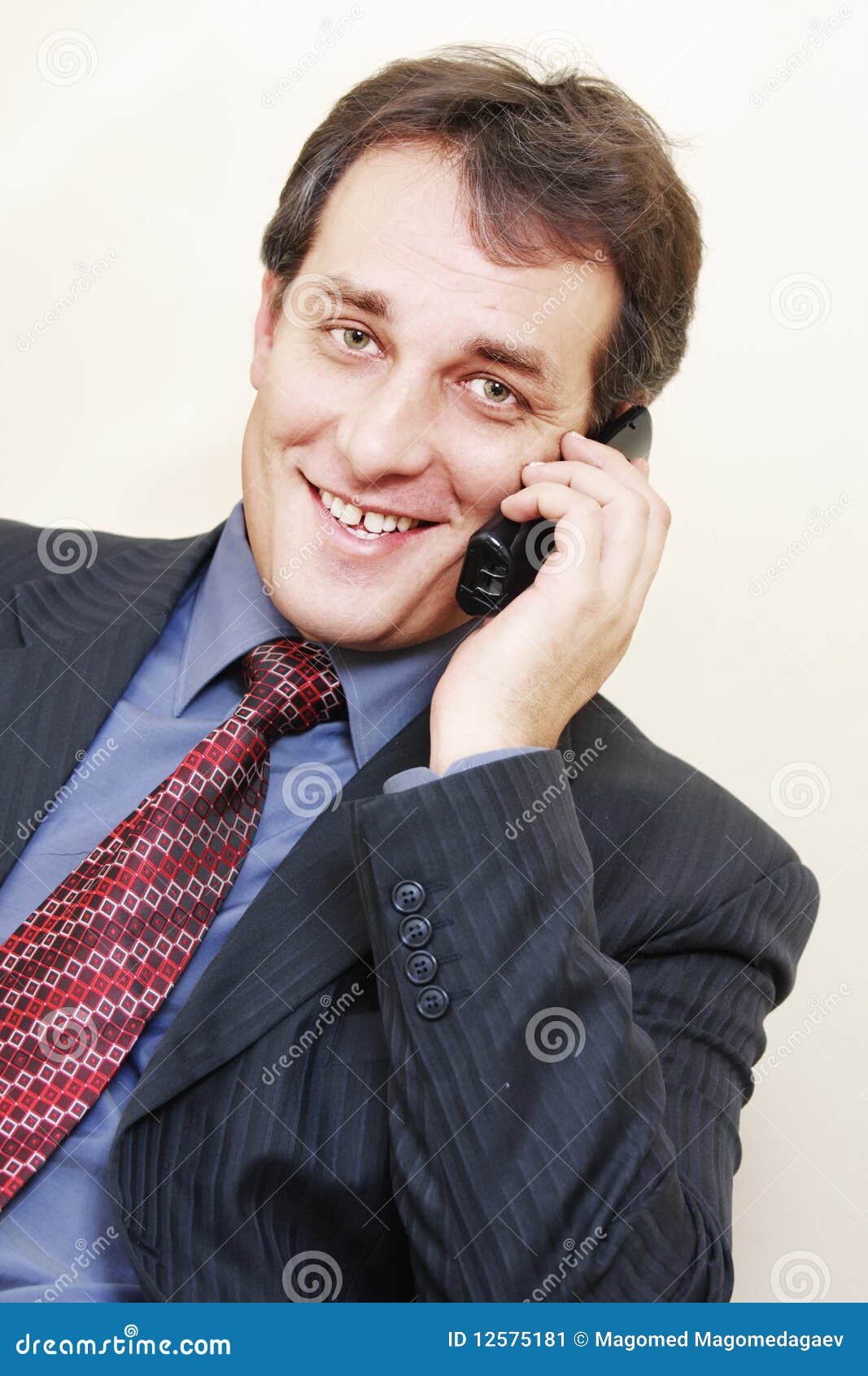 Smiling Businessman with Phone Inclining Left Stock Image - Image of ...