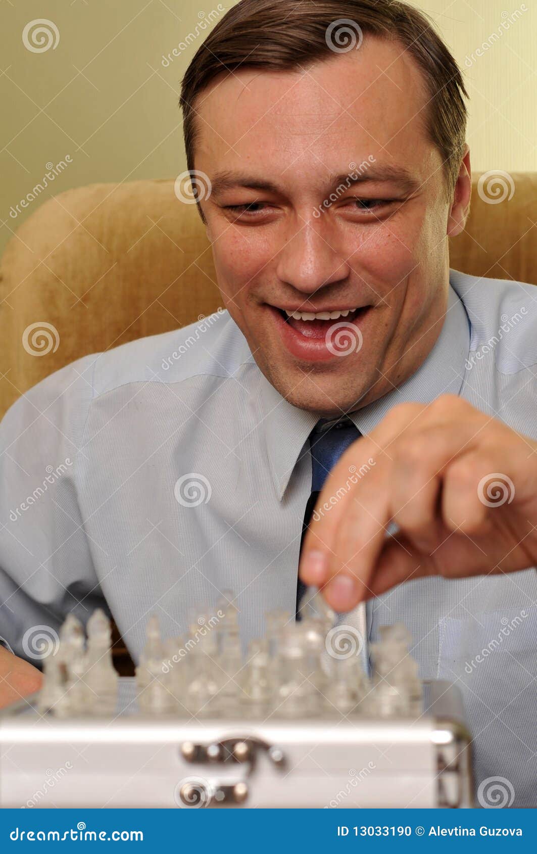 Smiling Businessman Playing Chess Stock Photo - Image of competition ...