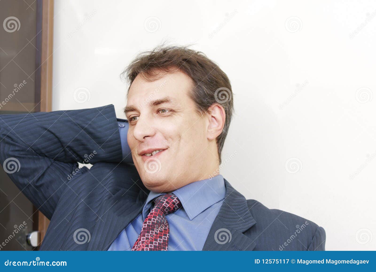Smiling Businessman Scratching Head Stock Image - Image of businessman ...