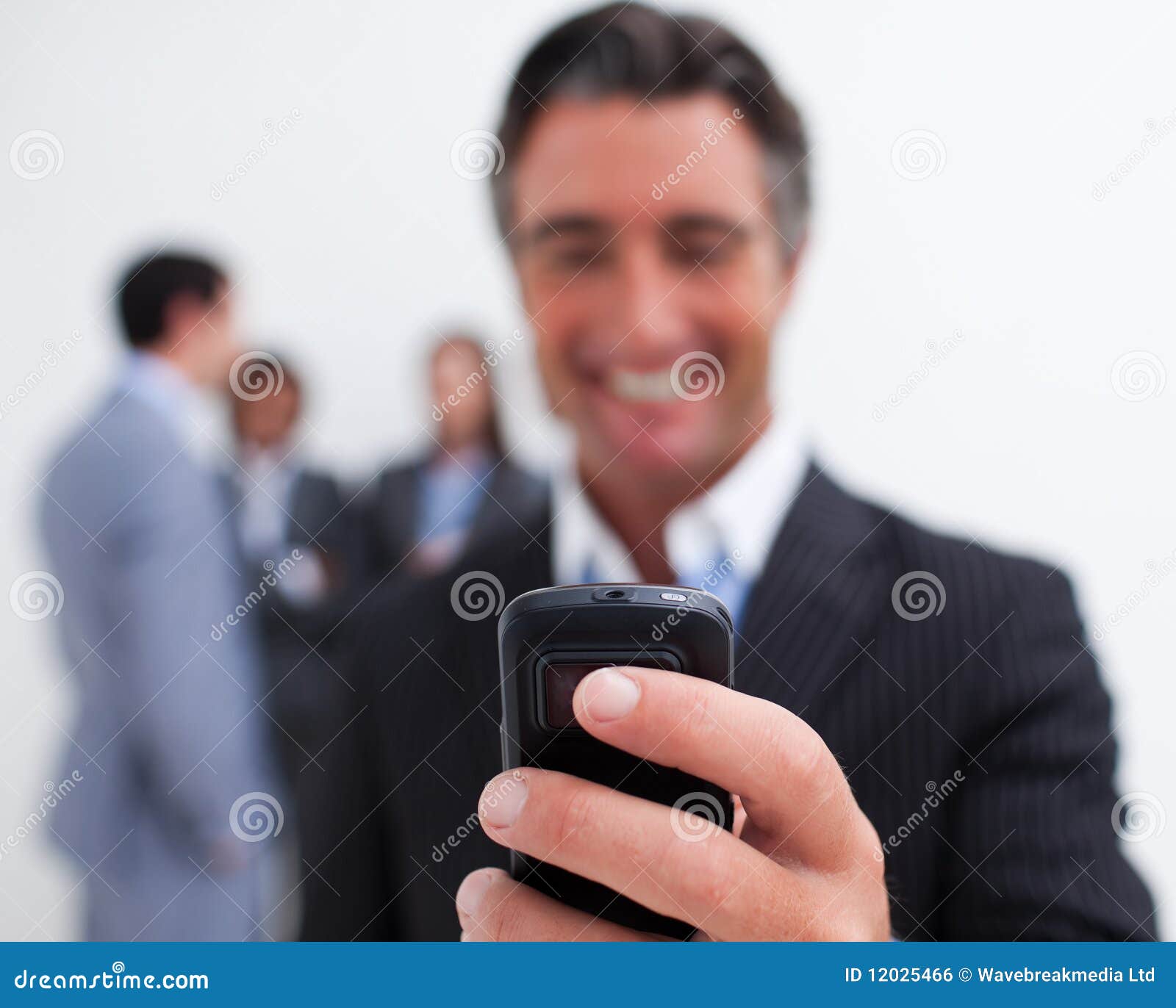 Smiling Businessman Sending a Text Stock Photo - Image of adult, office ...