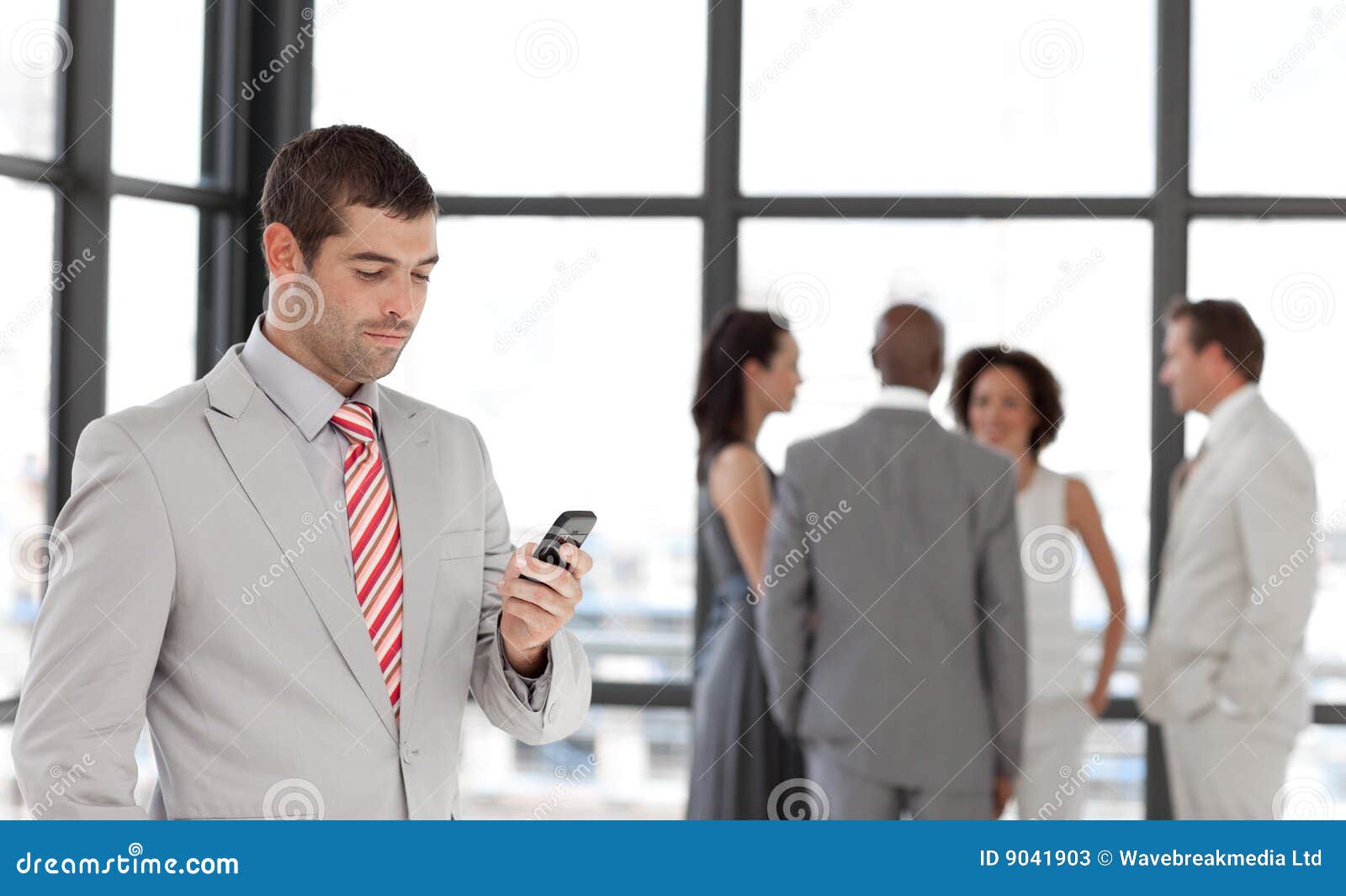 Smiling Businessman Sending a Text Message Stock Image - Image of human ...