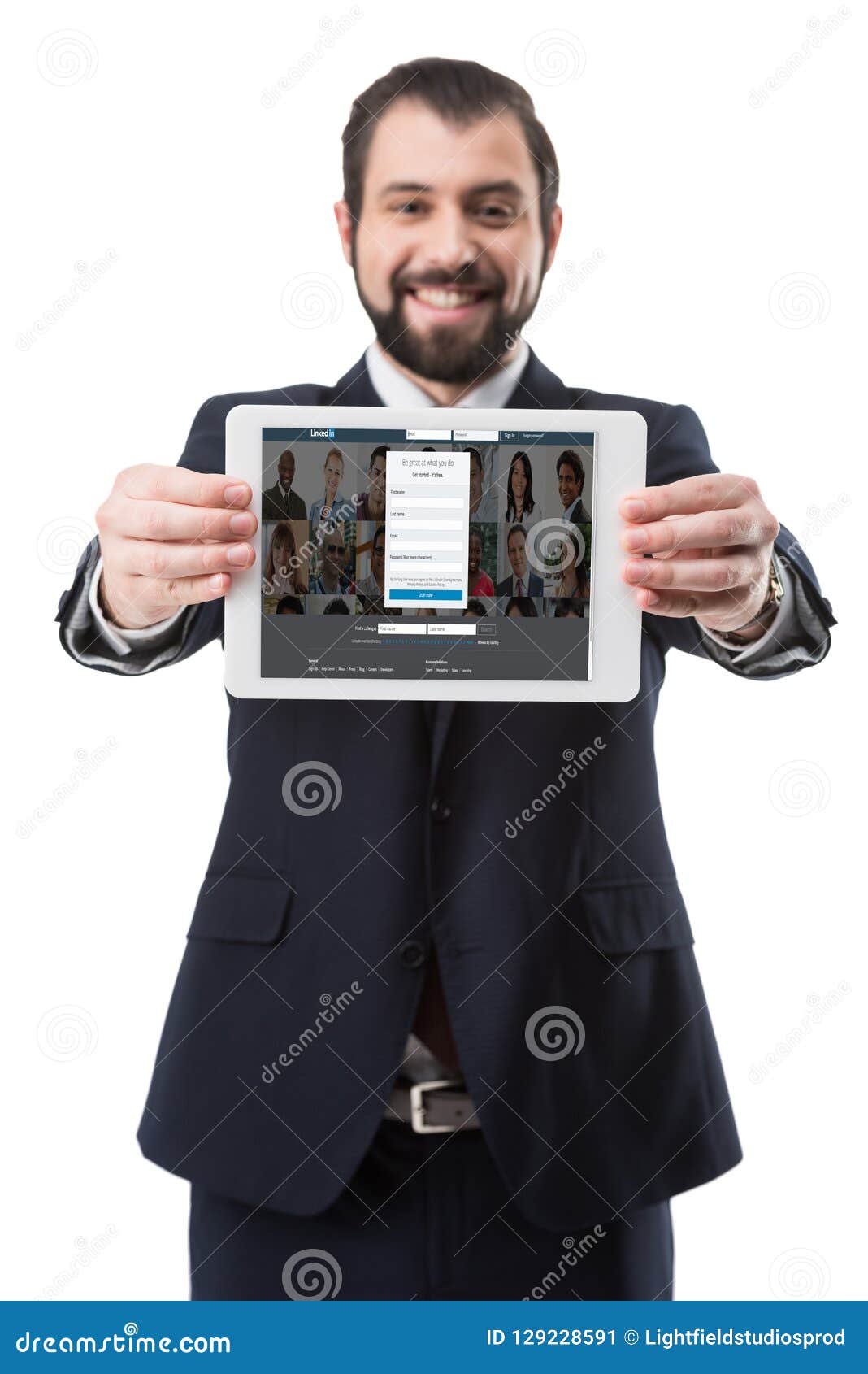 Smiling Businessman Showing Digital Tablet With Linkedin Website