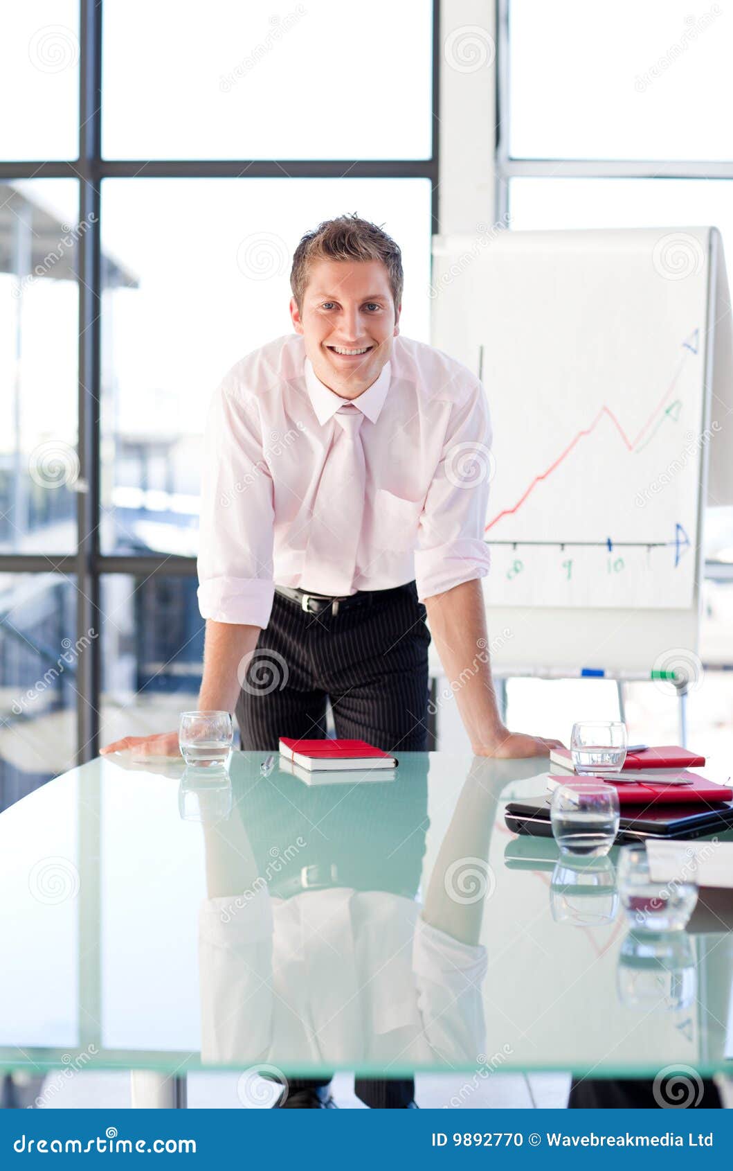 Smiling Businessman Standing in a Presentation Stock Photo - Image of ...