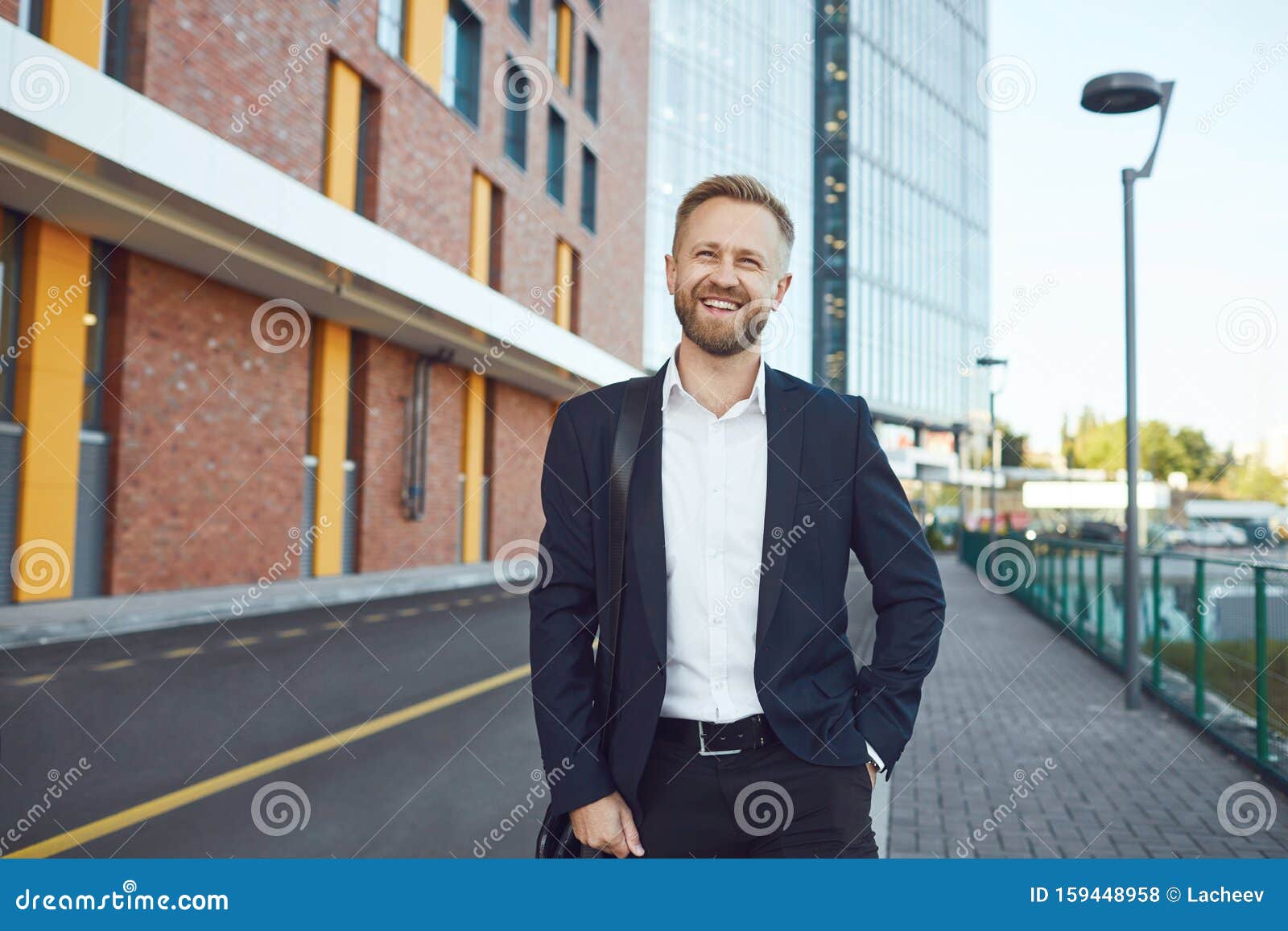 A Smiling Businessman is Standing on the Street. Stock Photo - Image of ... A Smiling Businessman is Standing on the Street. Stock Photo - Image of ...