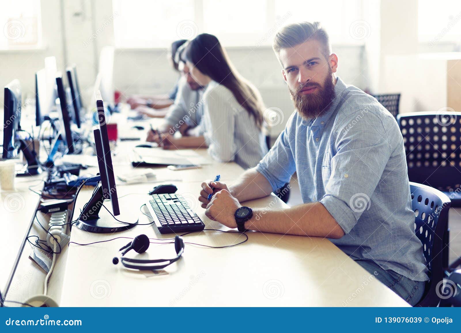 Smiling Businessman Using a Computer To Analyze Financial Data. Stock ...