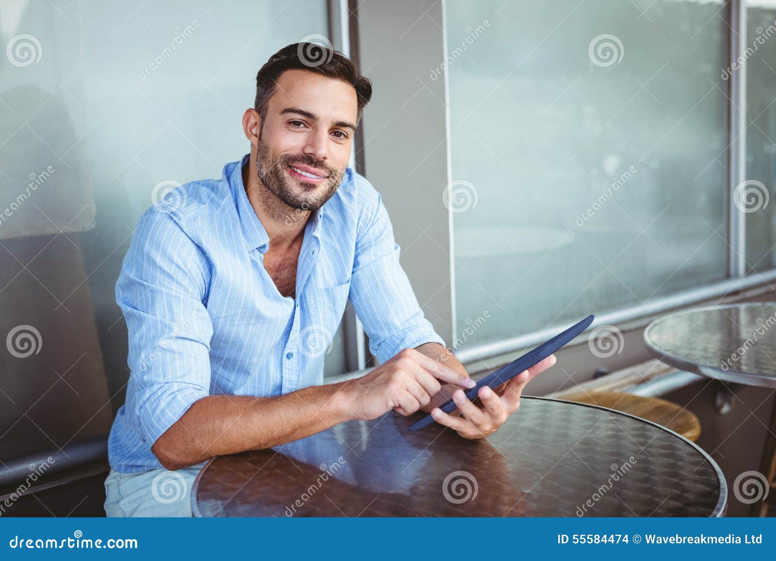 Smiling Businessman Using a Tablet Stock Photo - Image of customer ... Smiling Businessman Using a Tablet Stock Photo - Image of customer ...