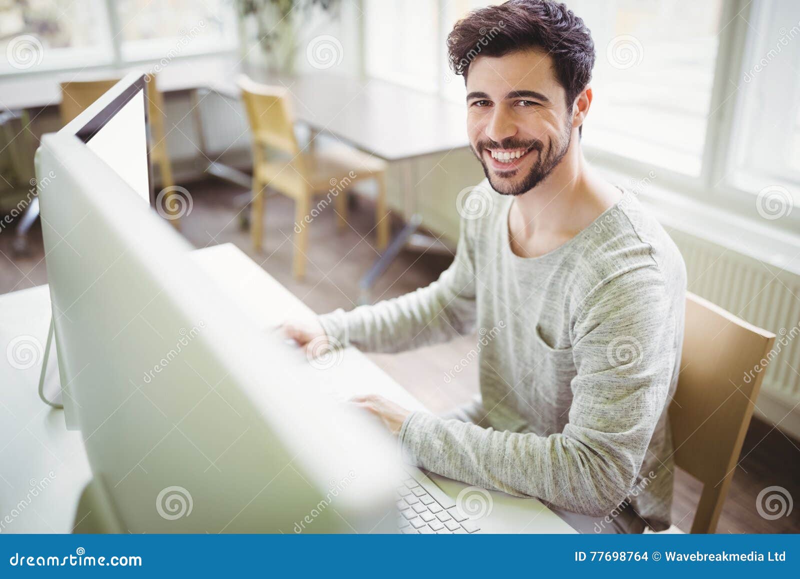 Smiling Businessman Working at Desk in Office Stock Photo - Image of ...