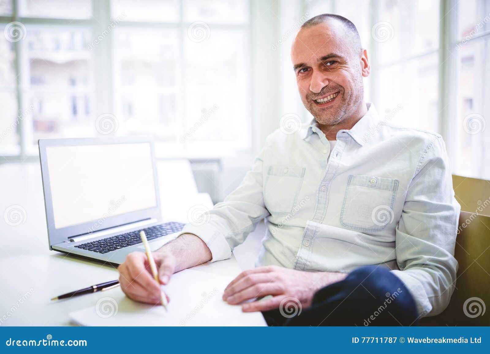Smiling Businessman Writing Document Stock Image - Image of book ...