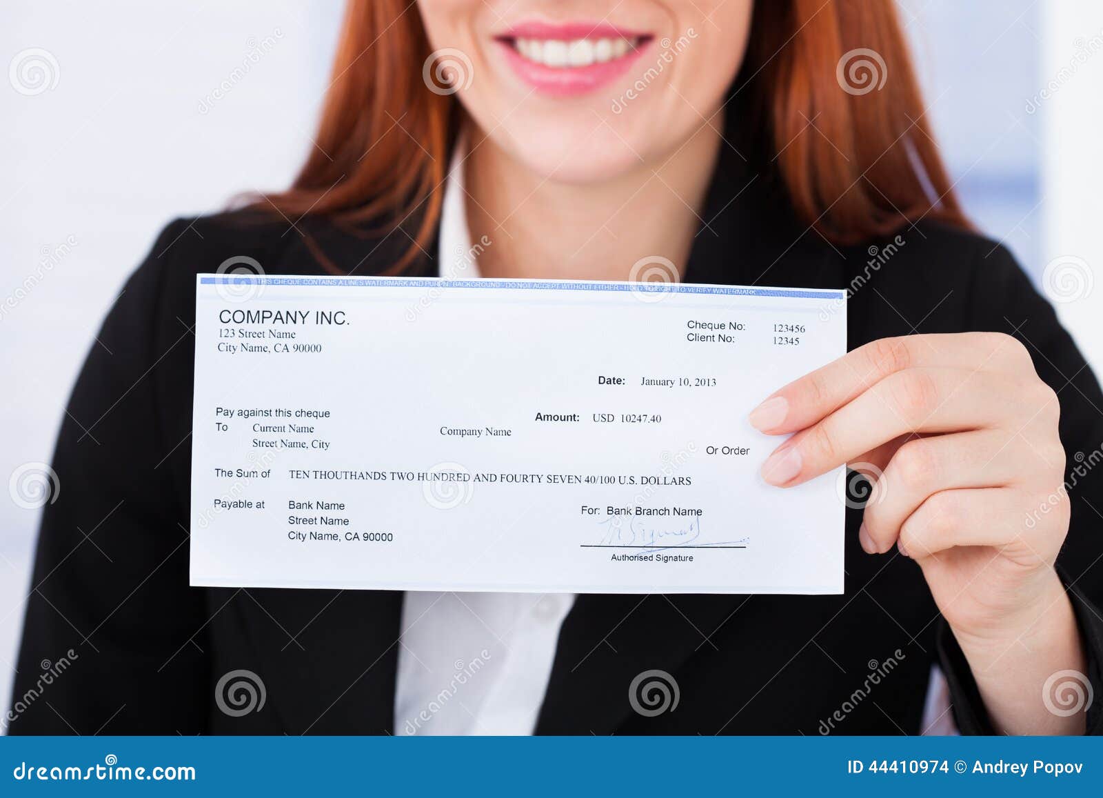 Smiling Businesswoman Holding Cheque Stock Photo - Image of holding ...