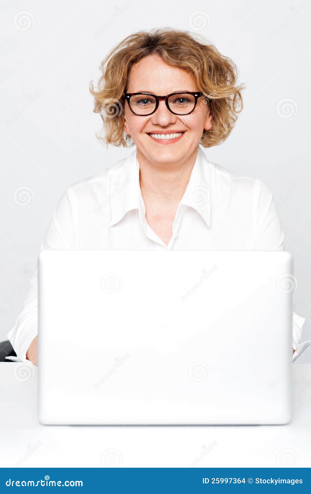 Smiling Businesswoman Sitting in Front of Laptop Stock Photo - Image of ...