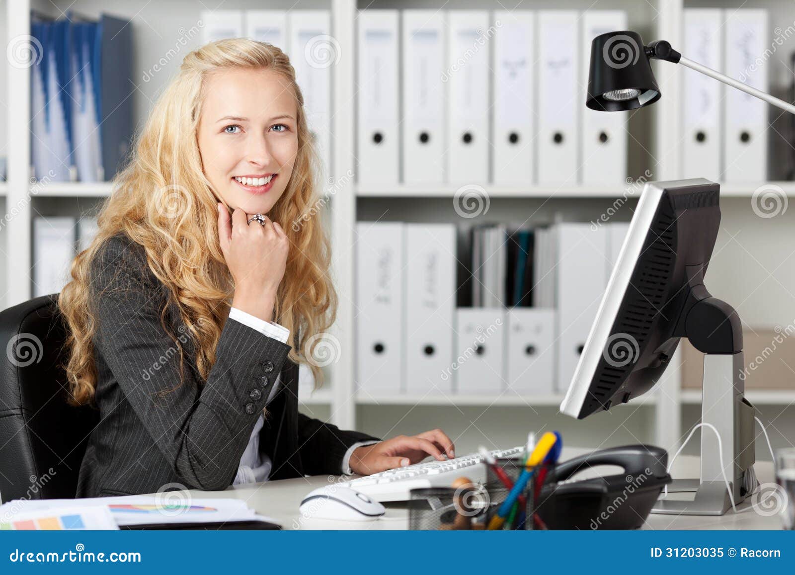 Smiling Businesswoman Using Computer at Desk Stock Image - Image of ...