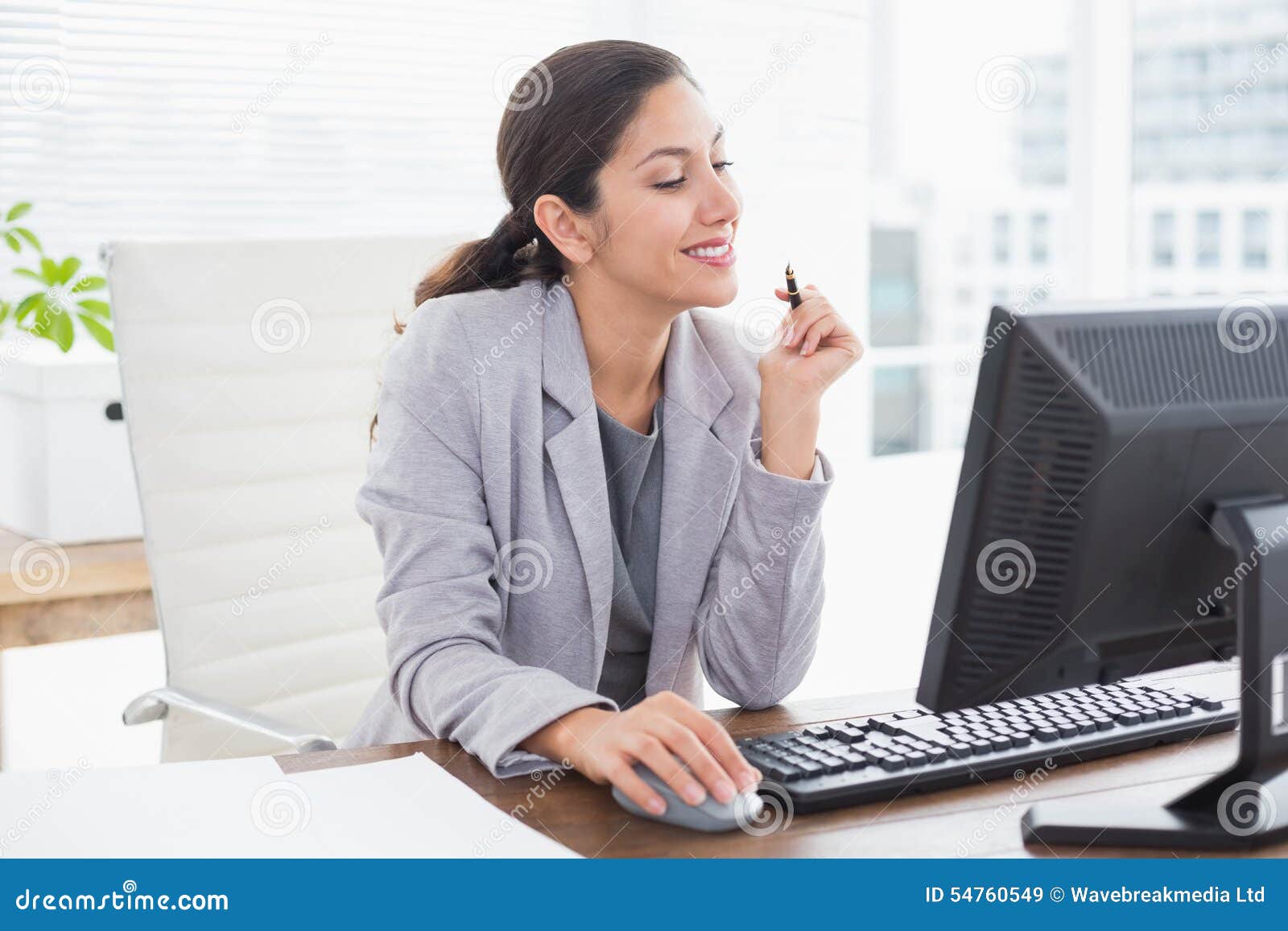 Smiling Businesswoman Using Her Computer Stock Image - Image of ...