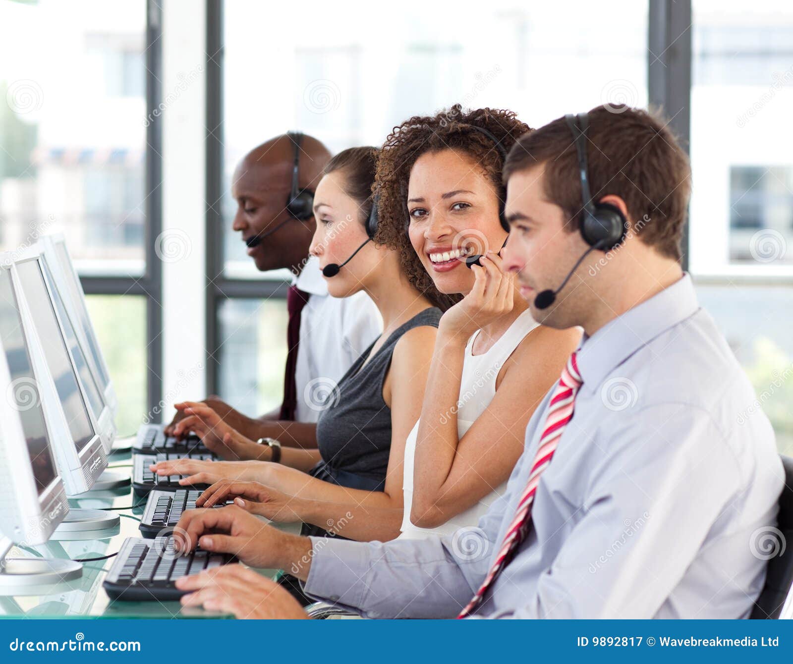 Smiling Businesswoman Working in a Call Center Stock Image - Image of ...