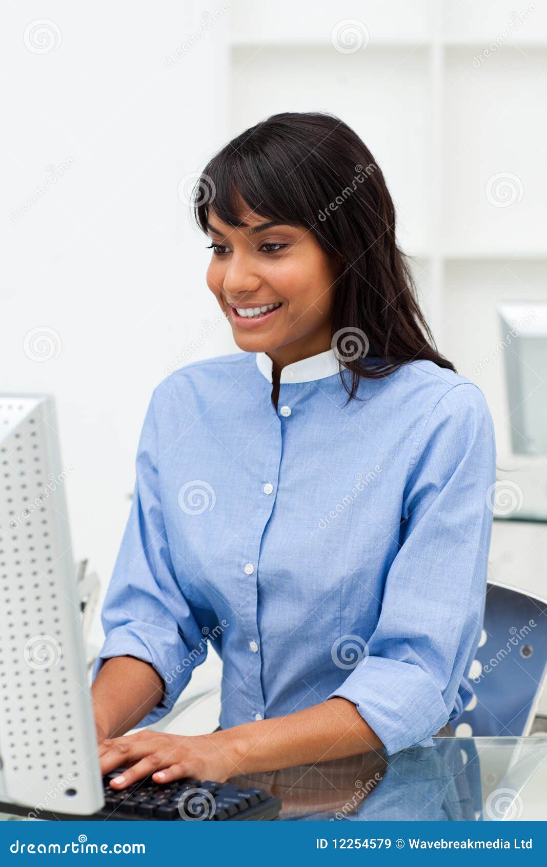 Smiling Businesswoman Working at a Computer Stock Image - Image of ...