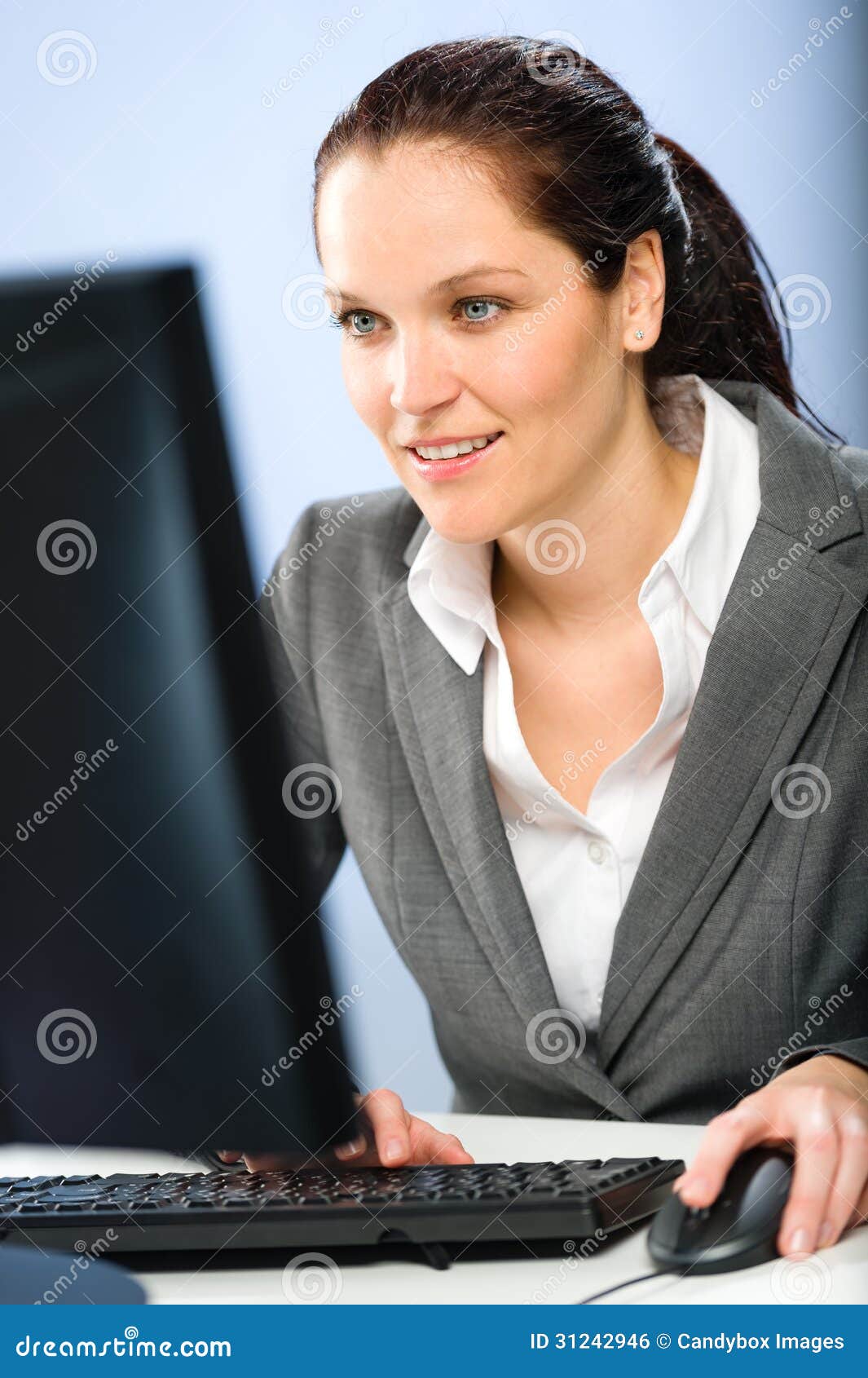 Smiling Businesswoman Working on Her Computer Stock Photo - Image of ...