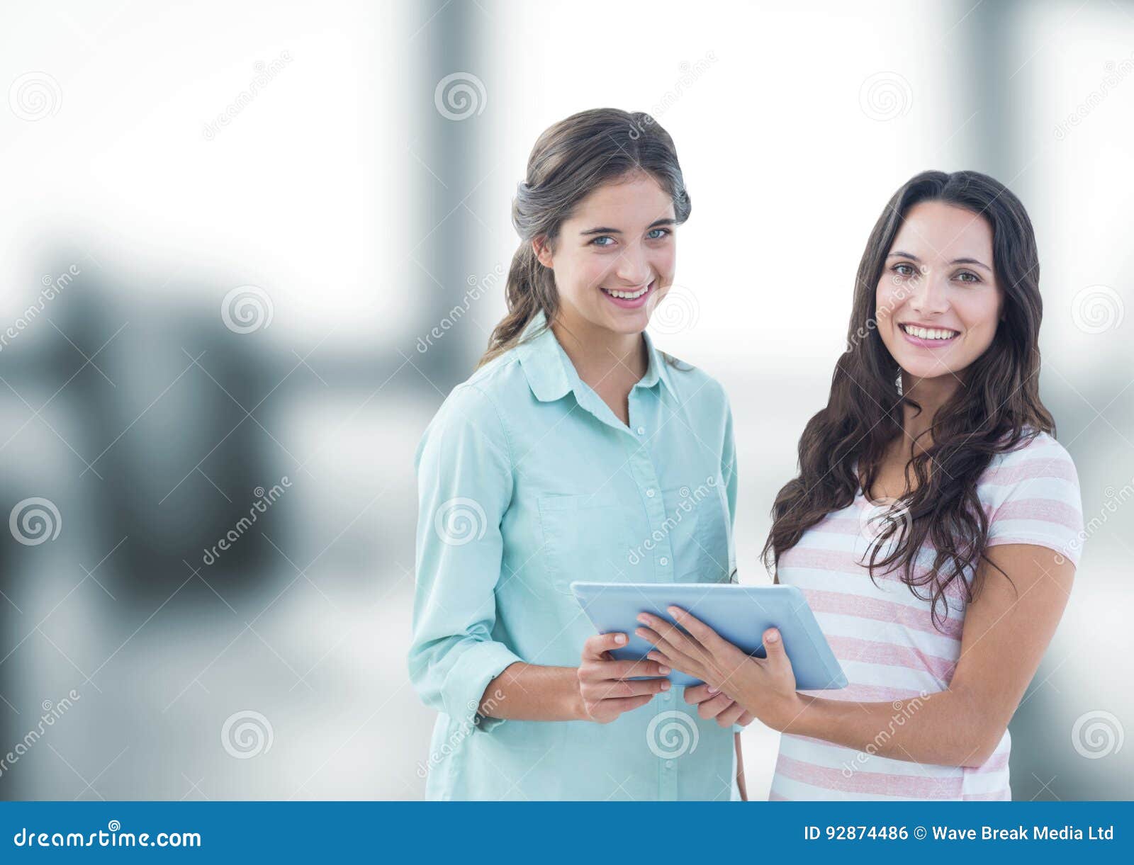 Smiling Businesswomen with Tablet PC in Office Stock Photo - Image of ...