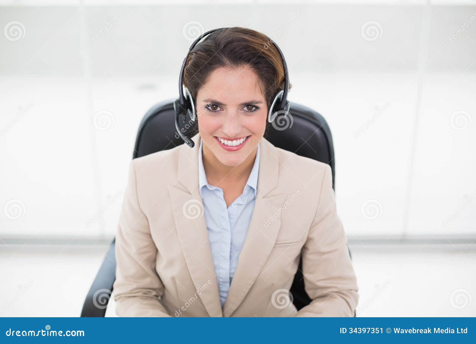 Smiling Call Center Agent Sitting in Swivel Chair Stock Image - Image ...