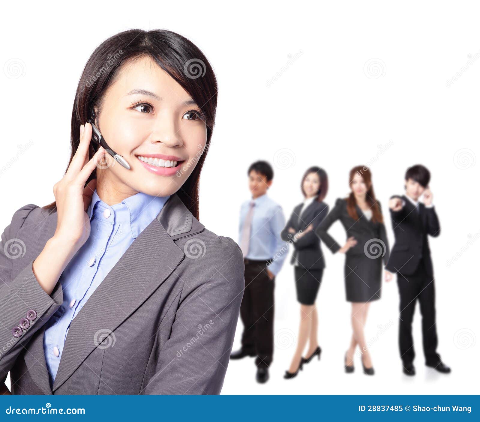 Smiling Call Center Executive with Colleagues Stock Image - Image of ...