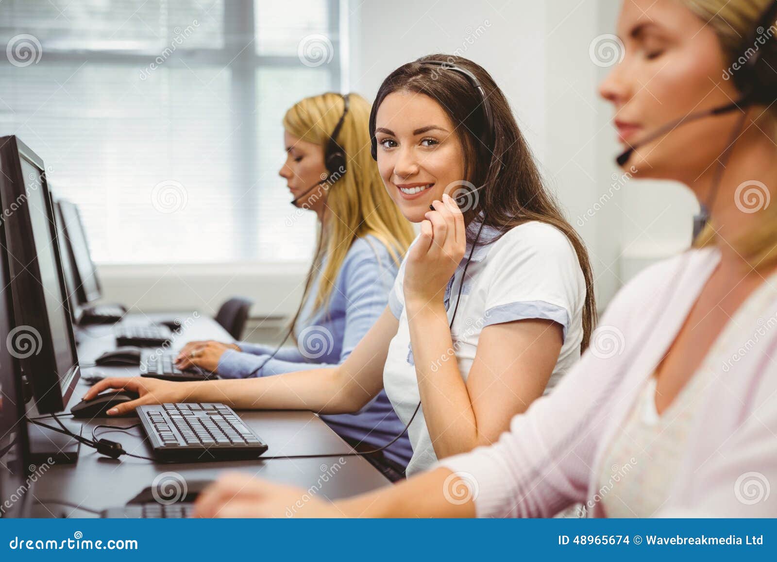 Smiling Call Centre Agent Talking on the Headset Stock Photo - Image of ...