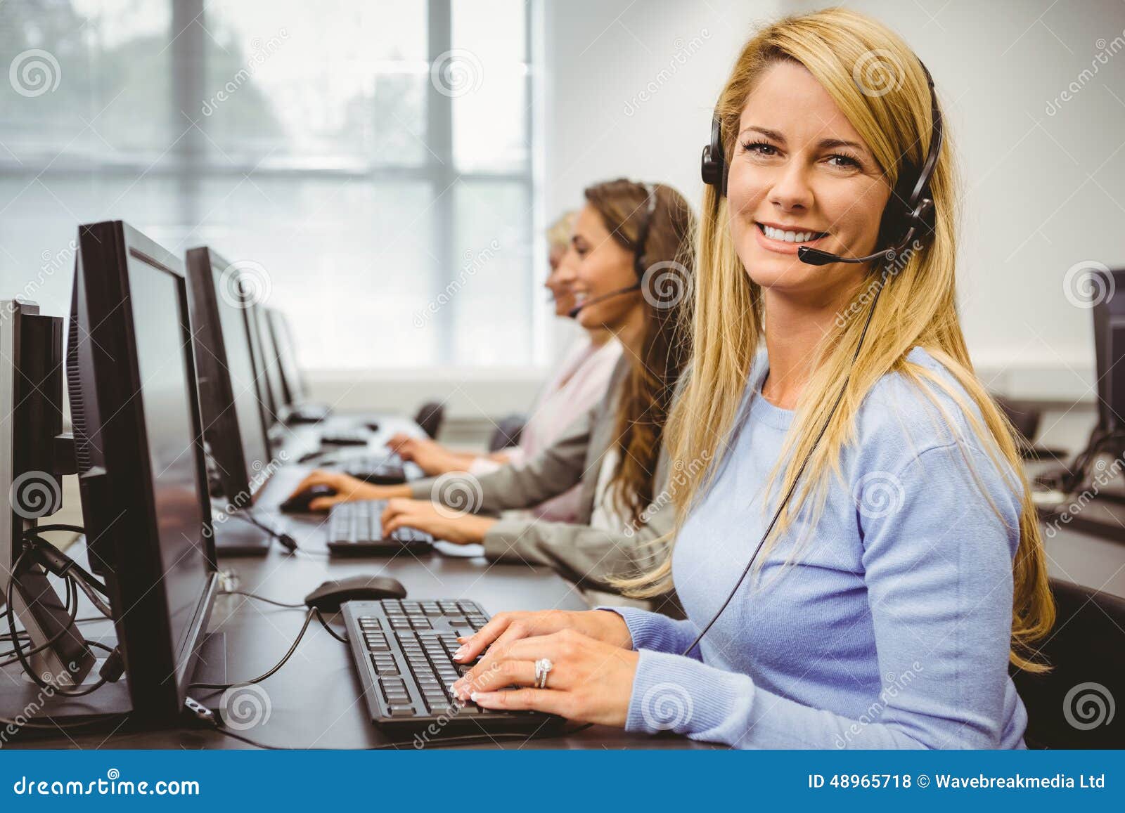 Smiling Call Centre Agent Talking on the Headset Stock Photo - Image of ...
