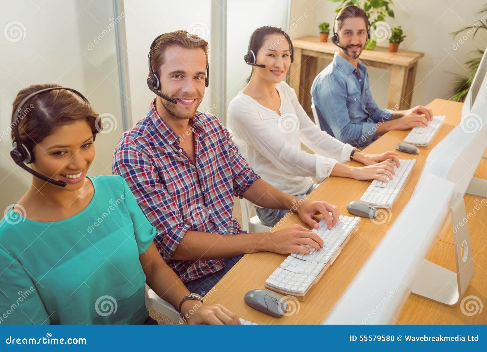 Smiling Call Centre Team Looking at the Camera Stock Photo - Image of ...
