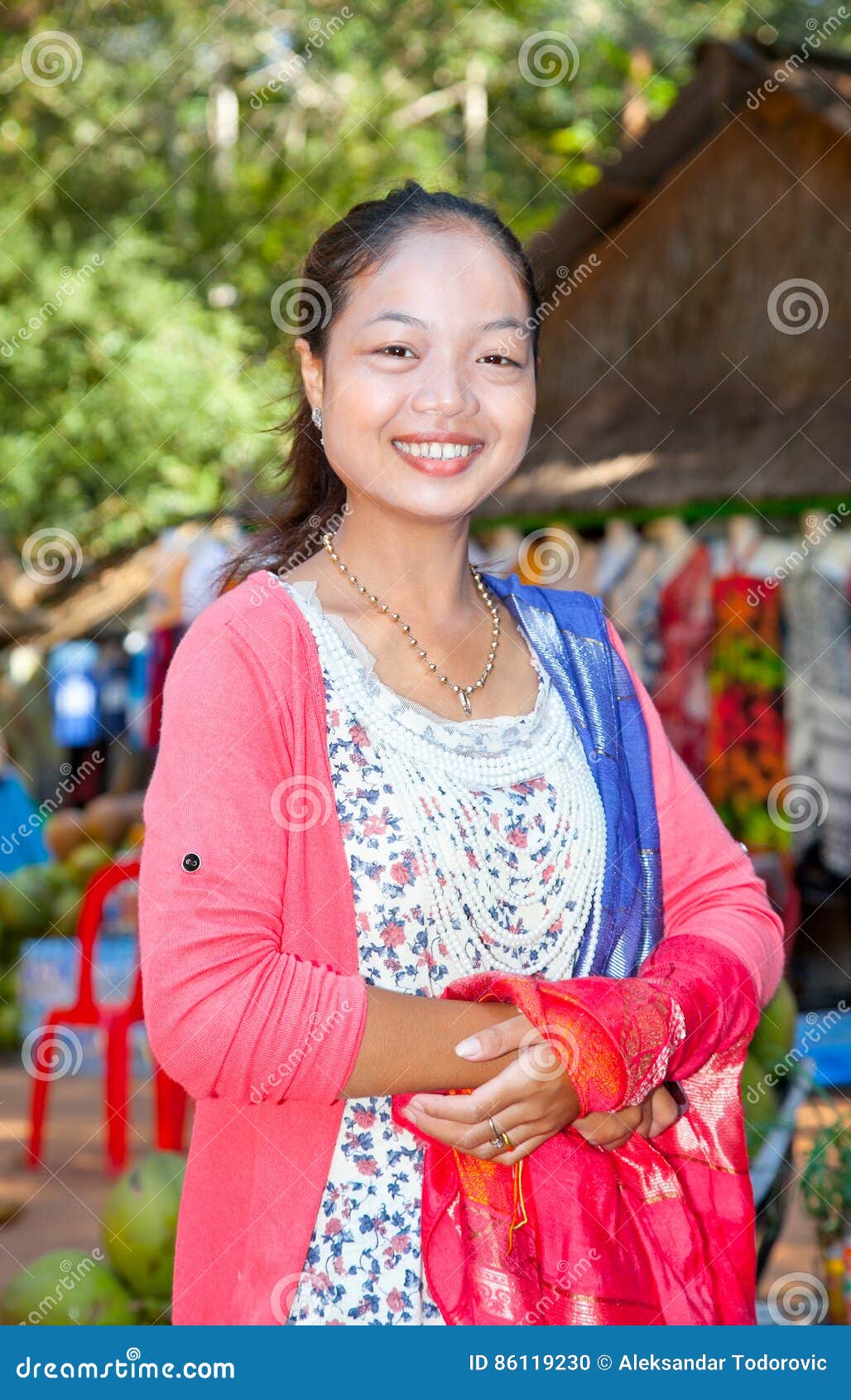 Smiling Cambodian Asian Girl In Traditional Dress At Angkor Wat Temple