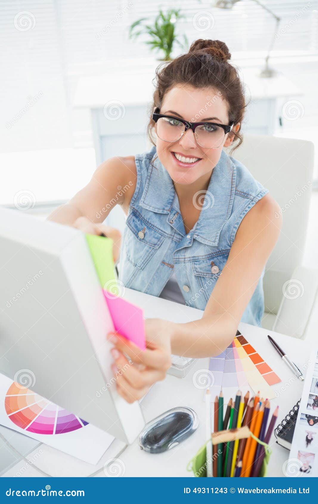 Smiling Casual Designer Using Colour Wheel Stock Image - Image of ...
