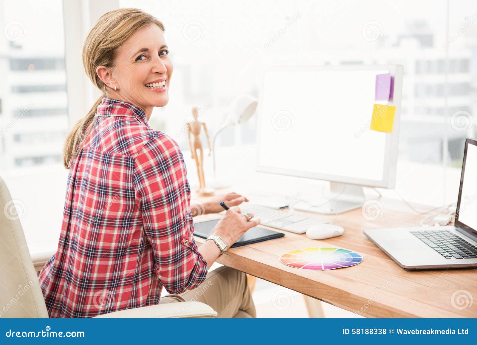 Smiling Casual Designer Using Computer and Digitizer Stock Photo ...