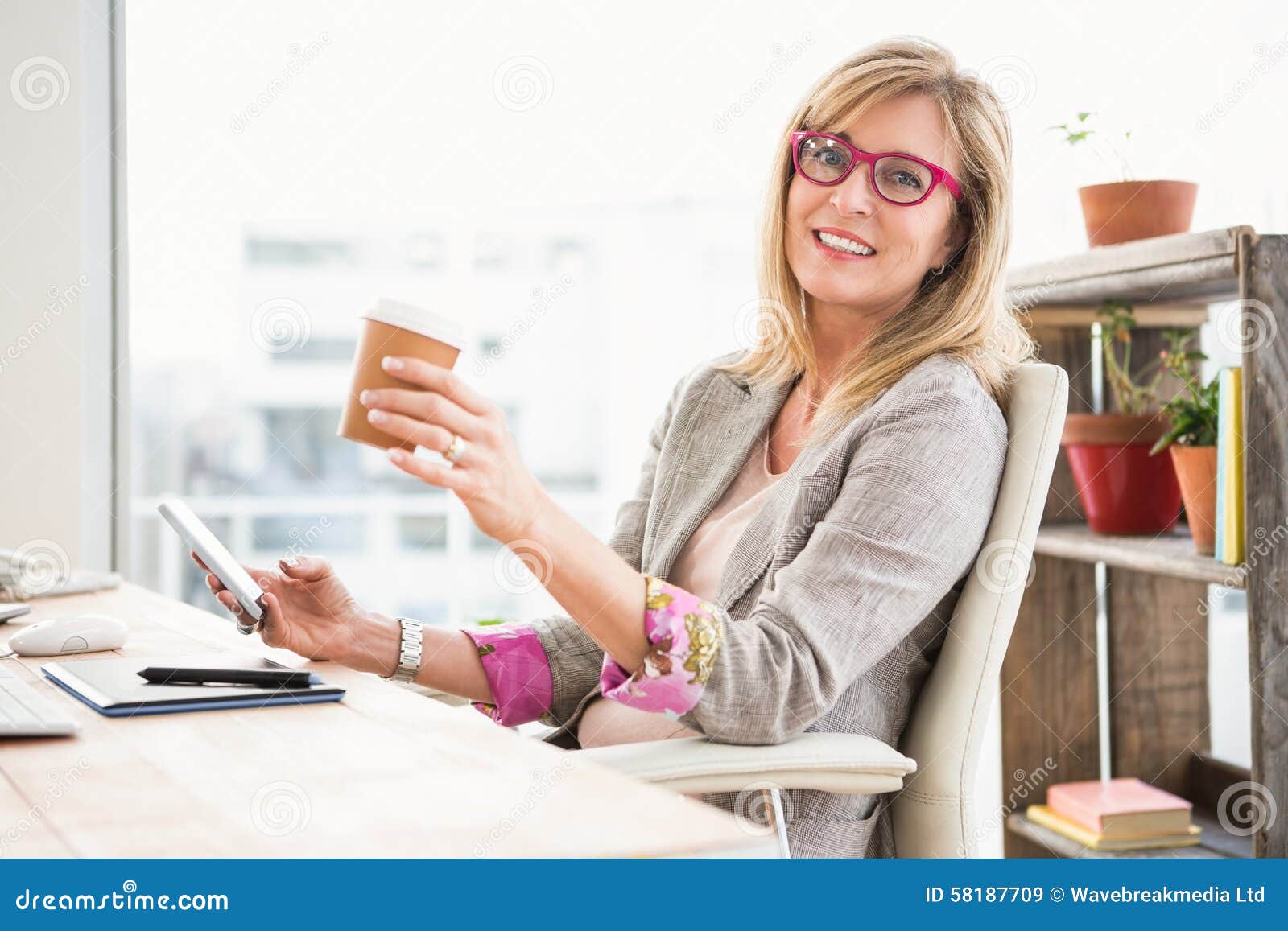 Smiling Casual Designer Using Smartphone Stock Image - Image of ...