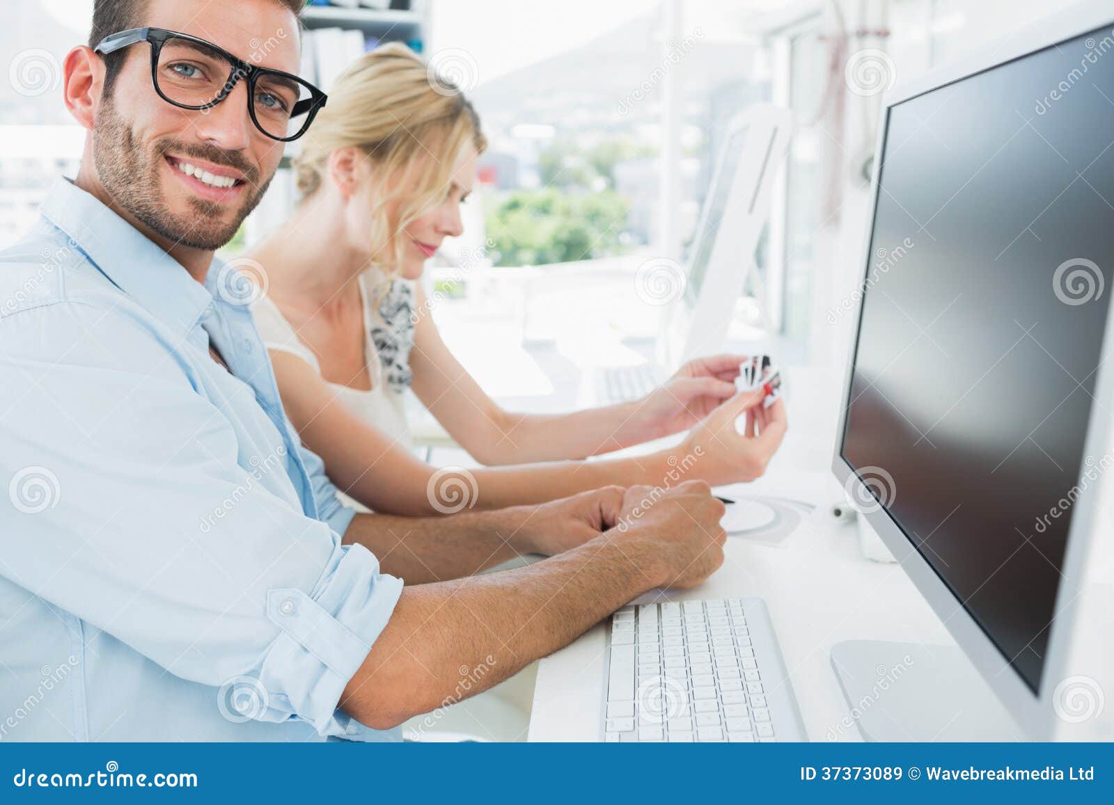 Smiling Casual Young Couple Working on Computer Stock Image - Image of ...