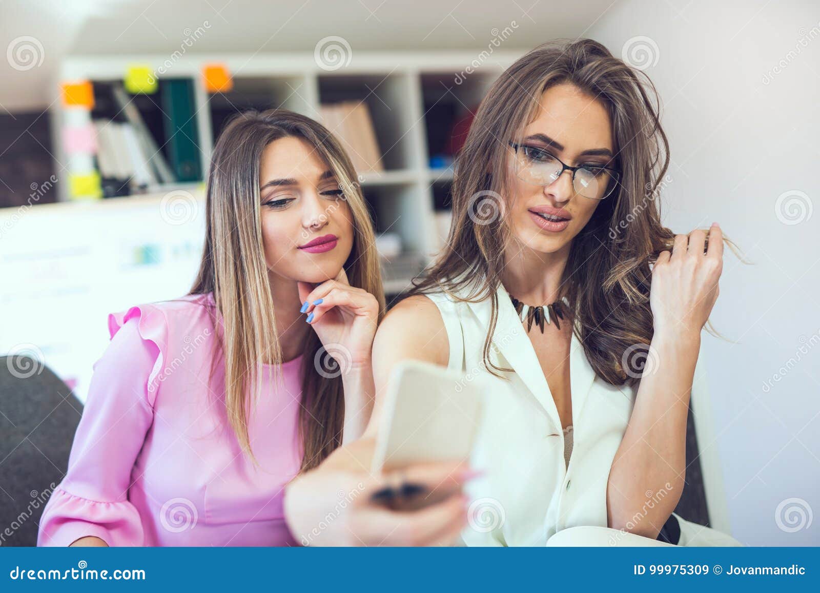 Smiling Cheerful Business Women Taking A Selfie In The Office Stock
