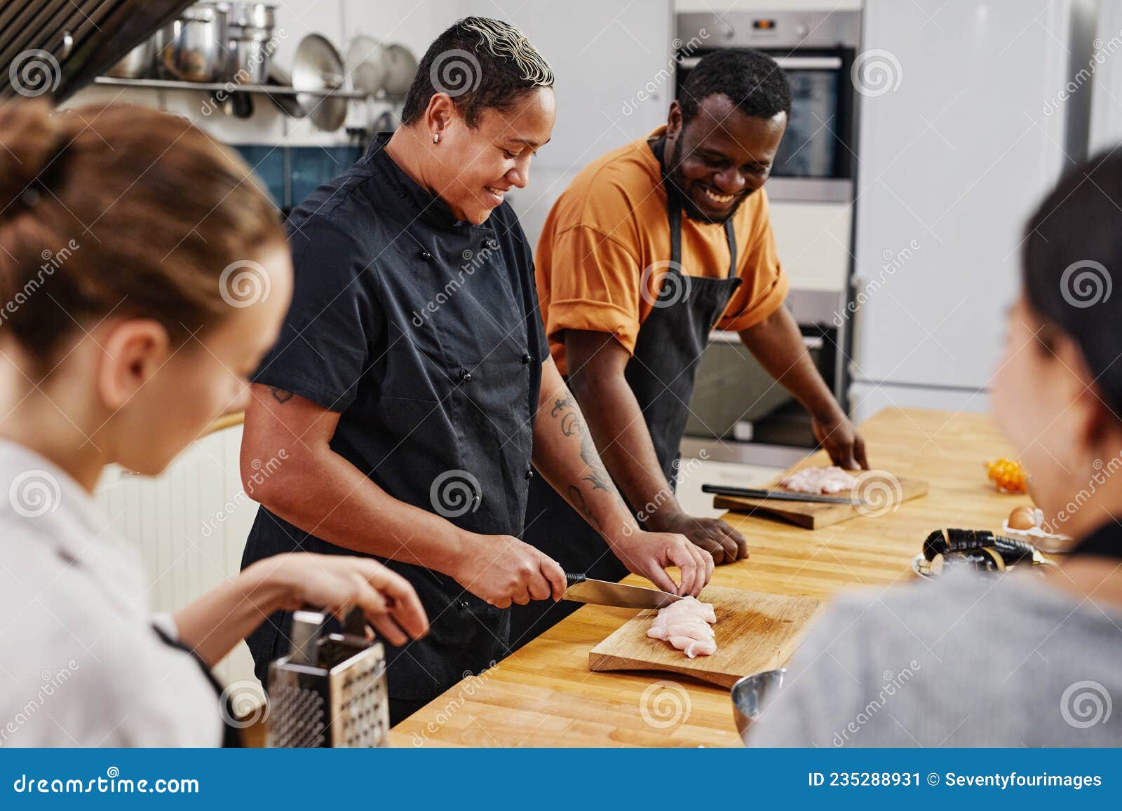 Smiling Chef in Cooking Workshop Stock Image - Image of male, table ...