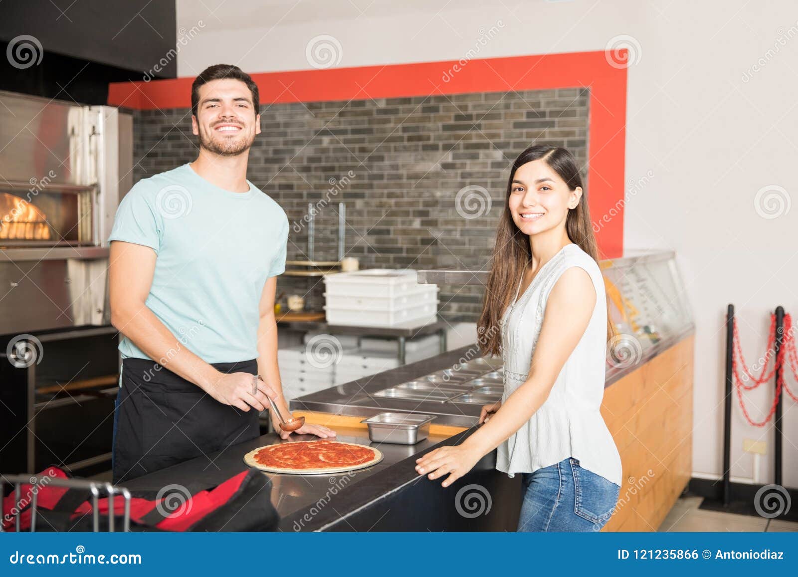 Smiling Chef Preparing Customized Pizza for Customer Stock Photo ...